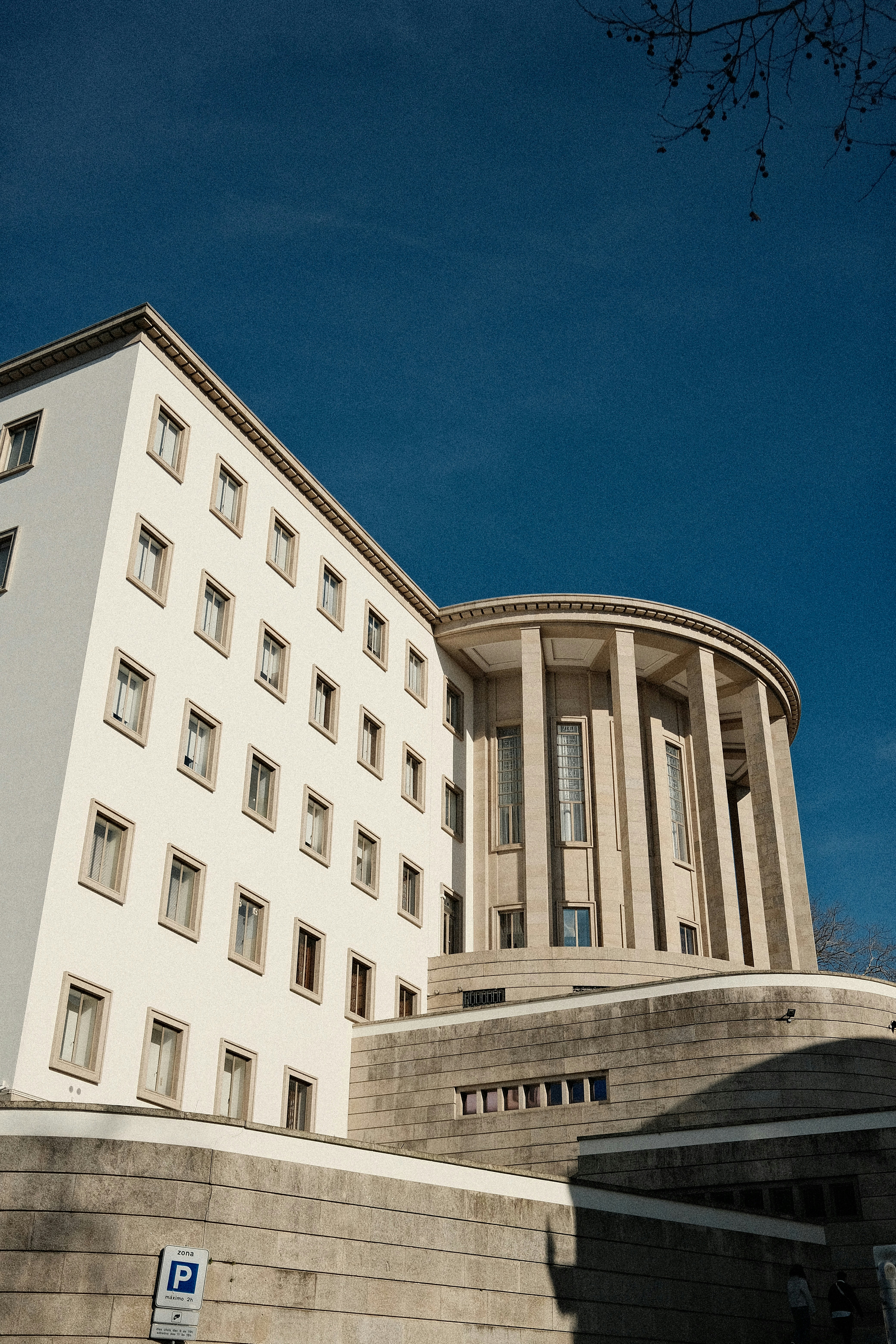 Ringed Facade: The Circular Pillars Meet a Quiet Urban Skyline