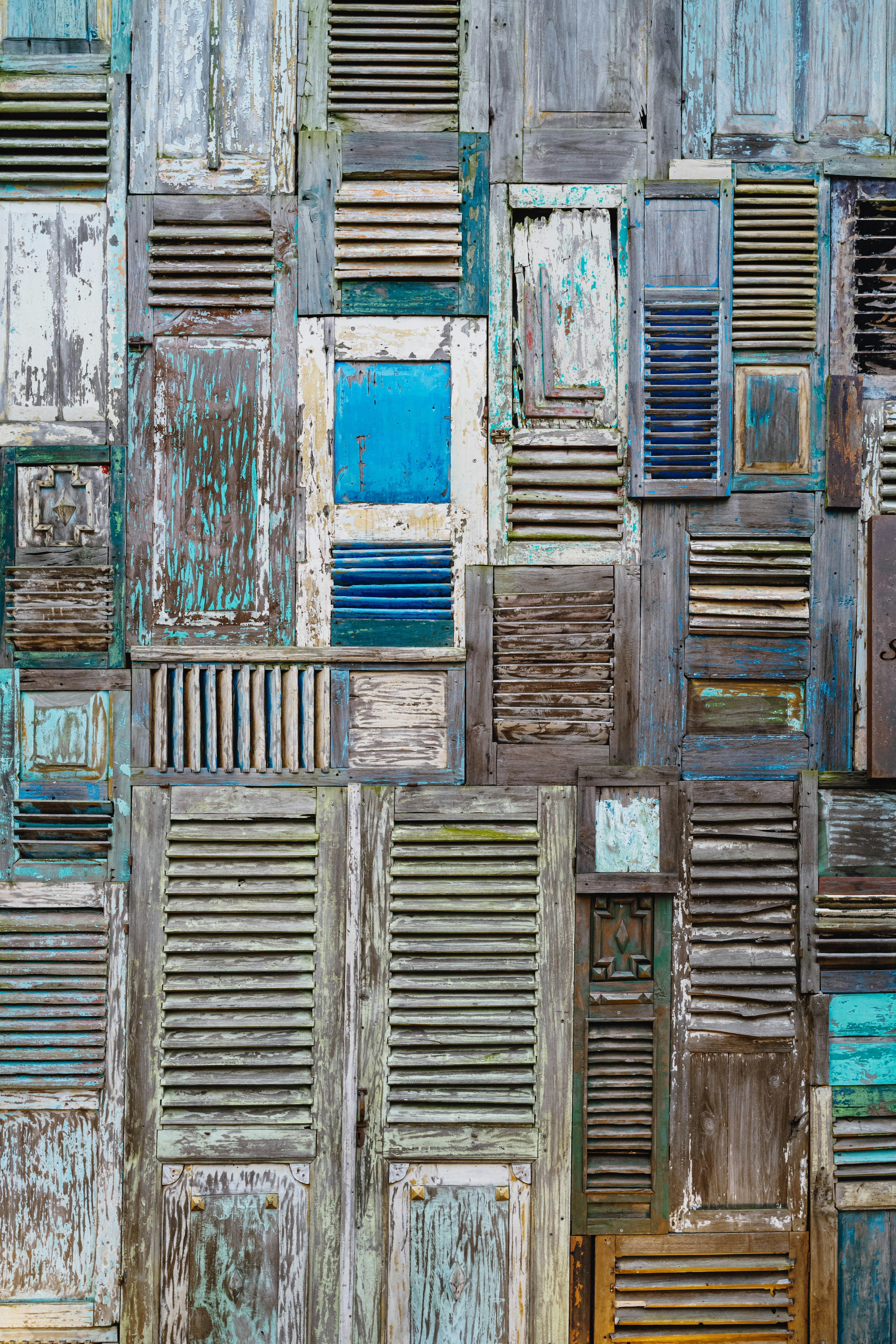 A Mosaic of Time: Weathered Shutters in Harmony