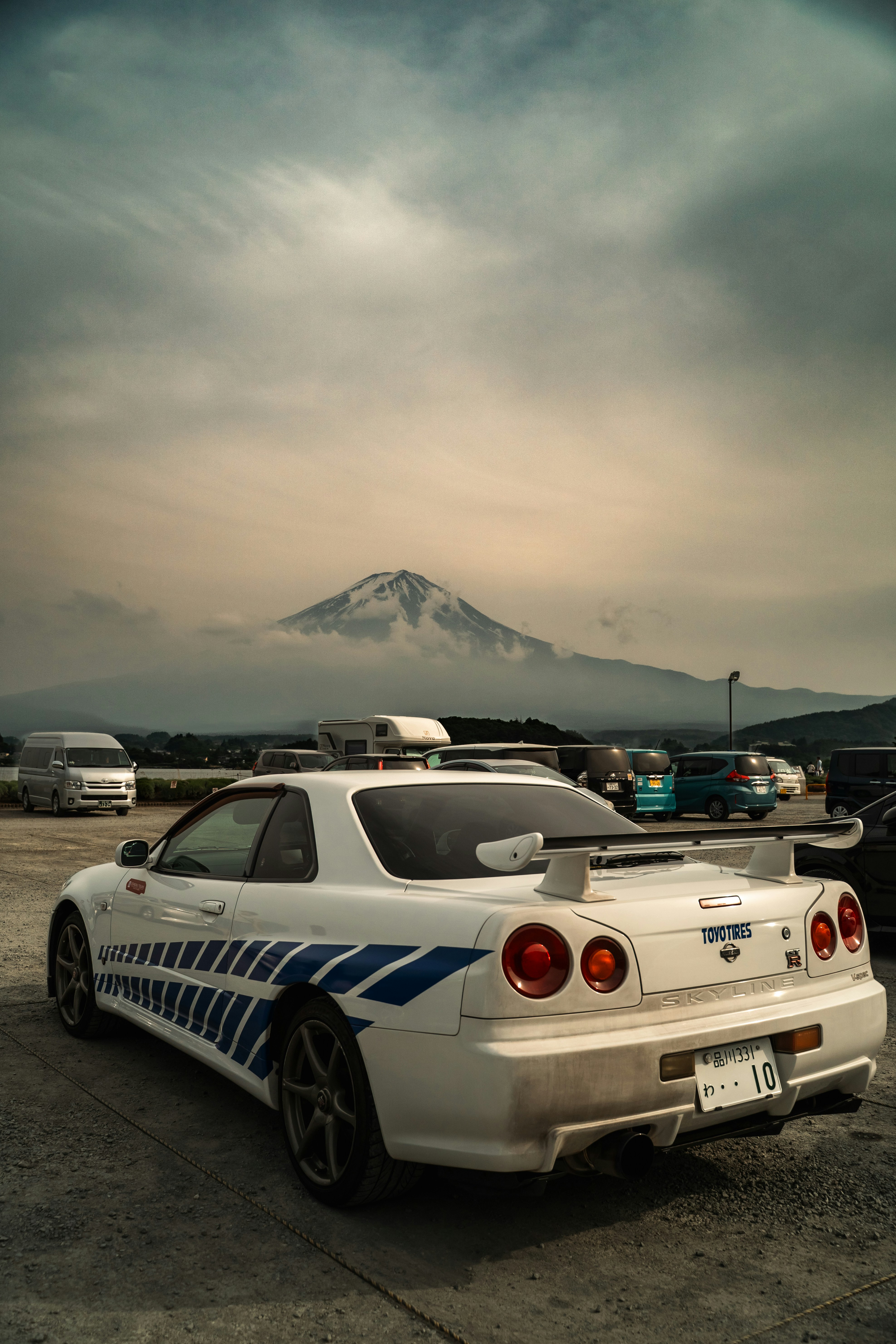 Rear Wing Reverie: A Fuji-Backed Parking Lot Portrait