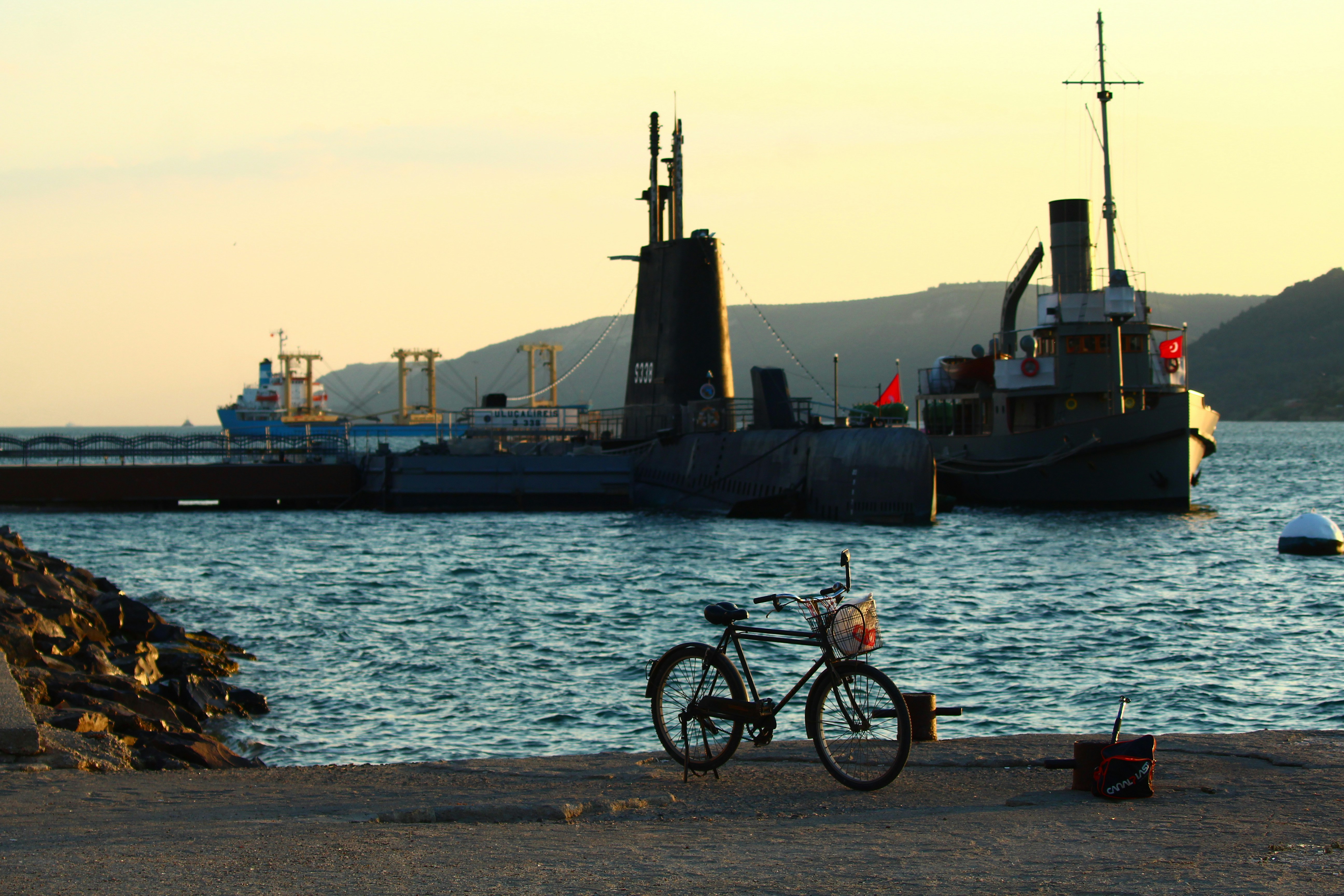 Quayside Quiet: A lone bicycle watches the harbor at dusk