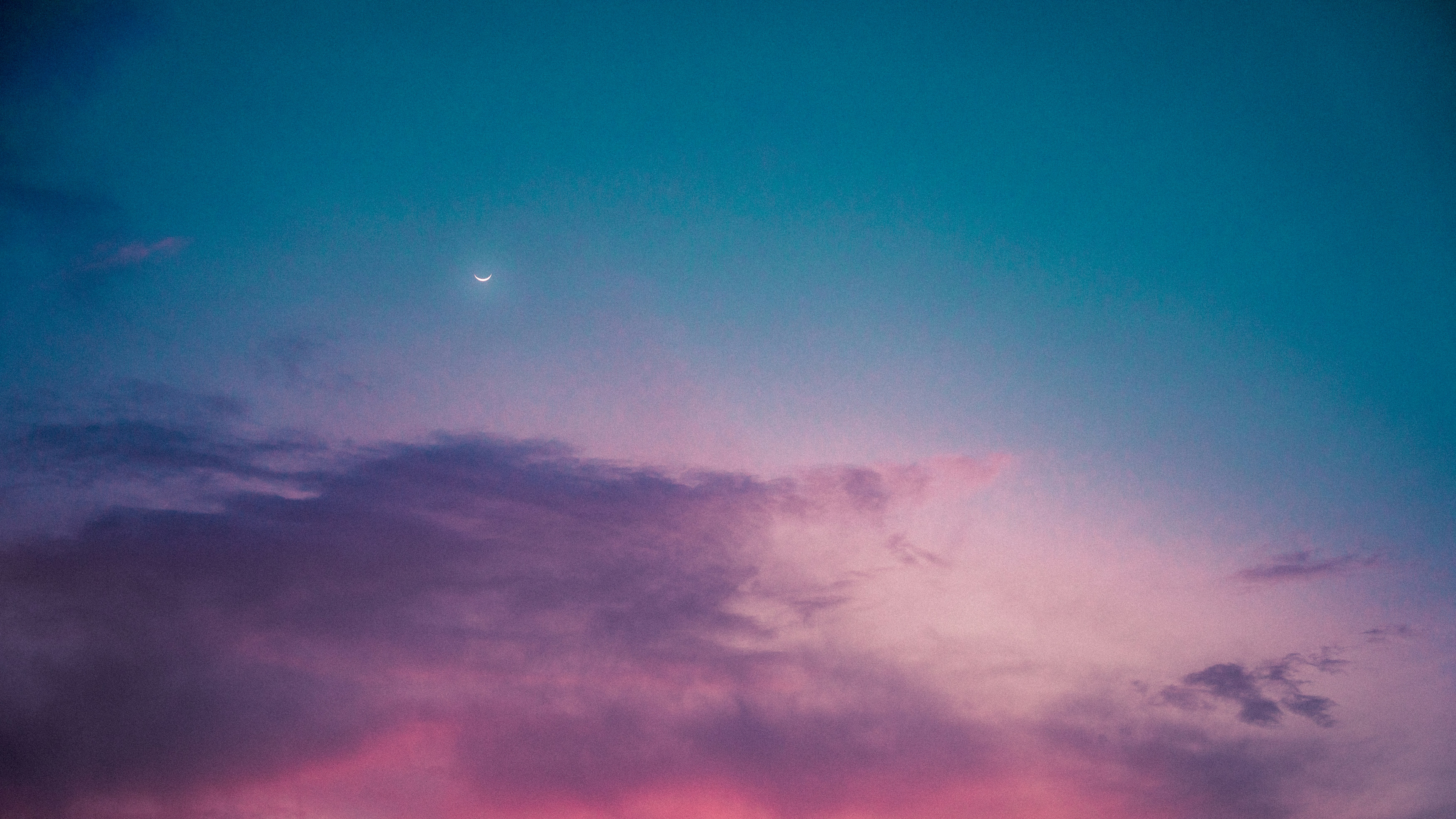 A sky not just seen but felt. | Soft, colorful clouds fill the blue sky.