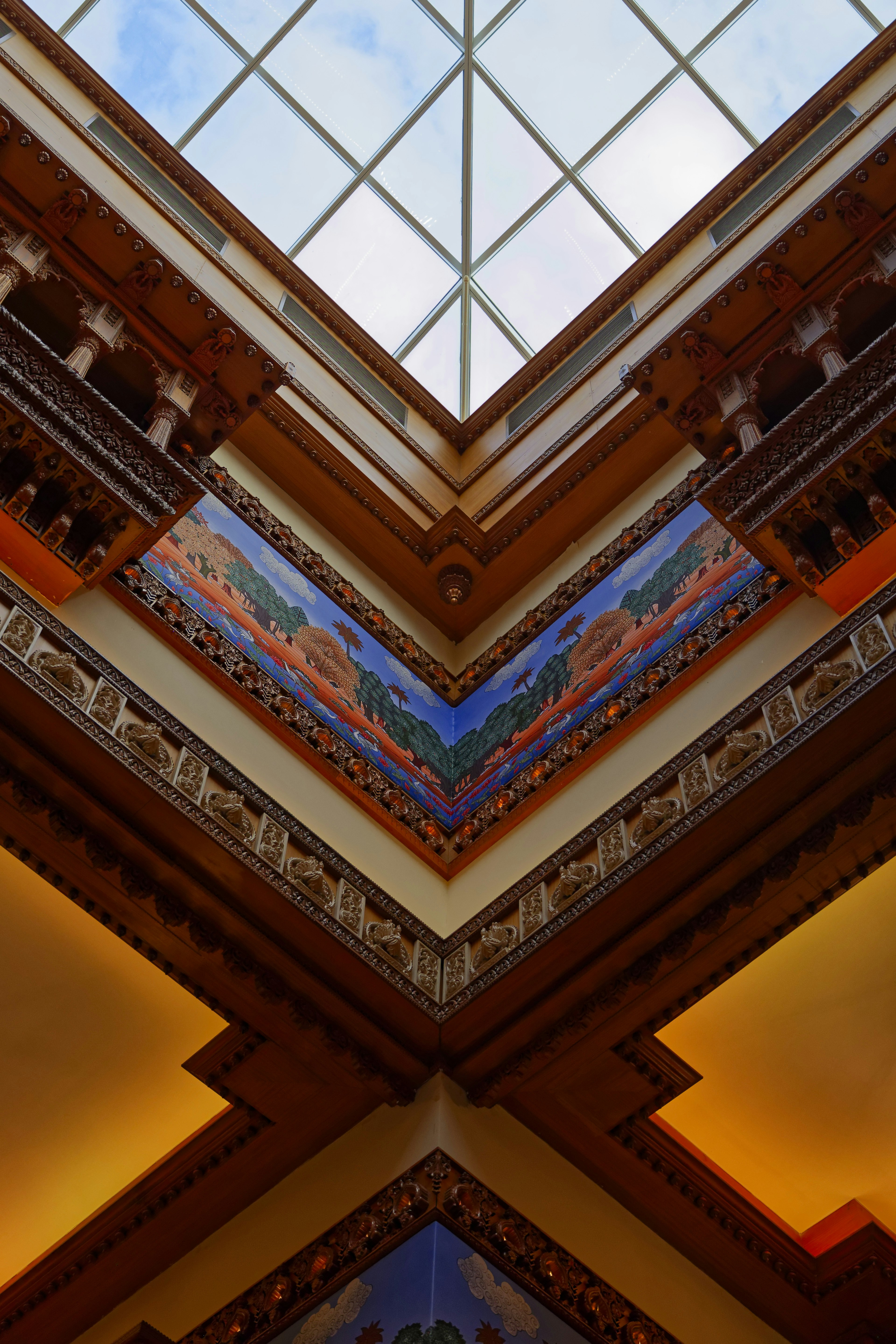 The interior features ornate architecture with a skylight. photo – Free ...