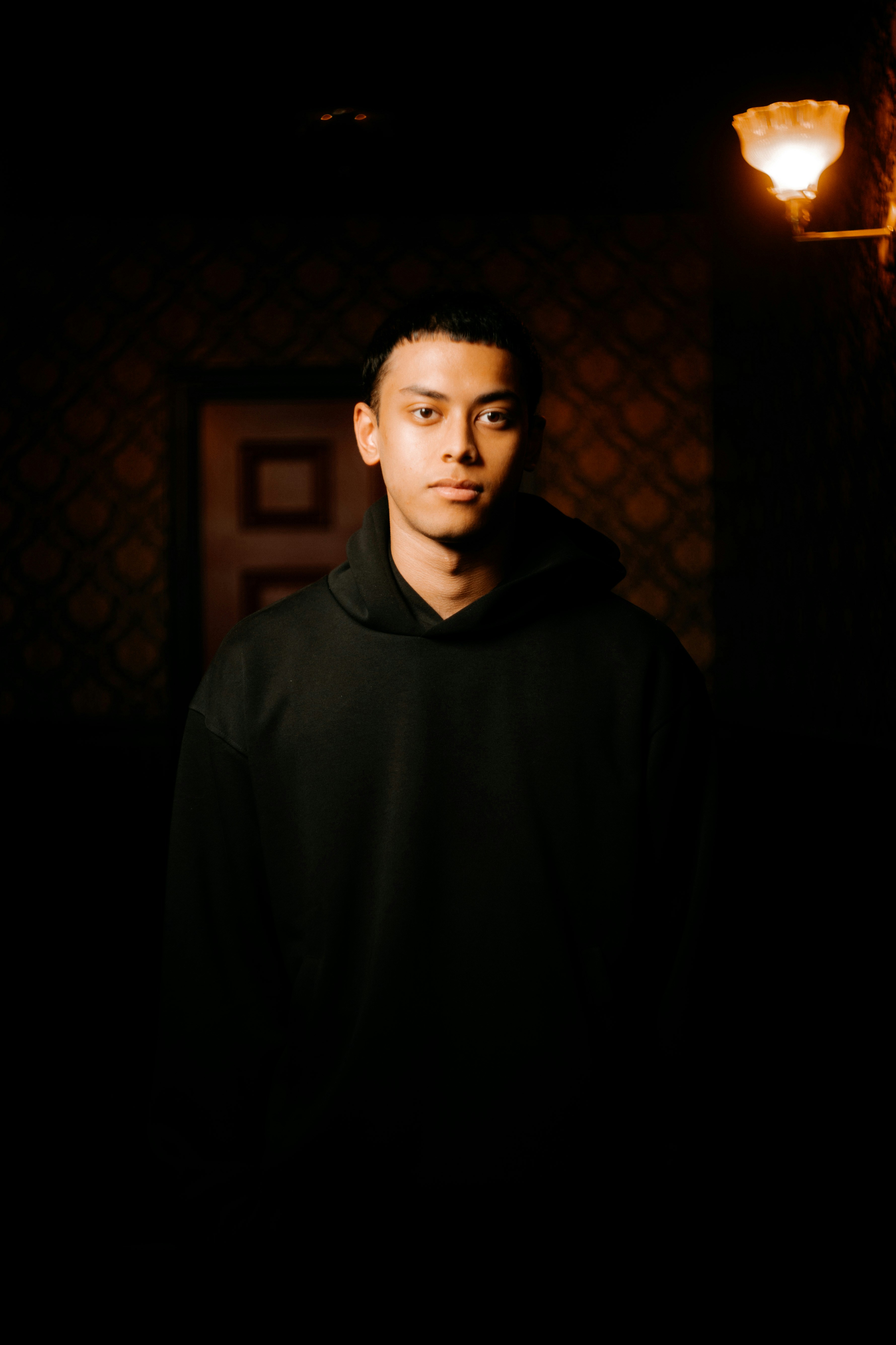 Portrait in Warm Glow: Quiet Confidence Beneath the Streetlamp