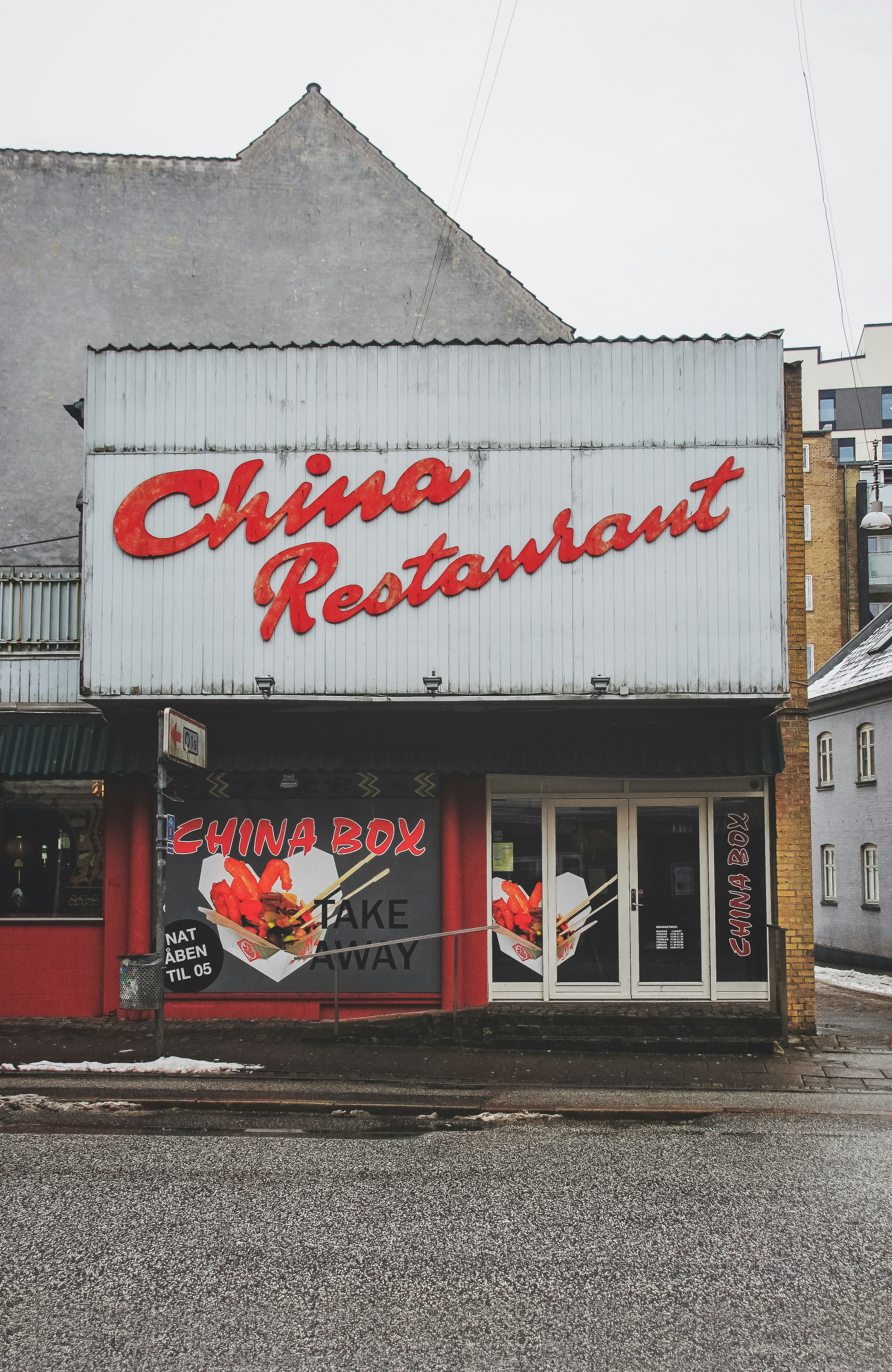 A chinese restaurant displays its name and take away option. photo ...