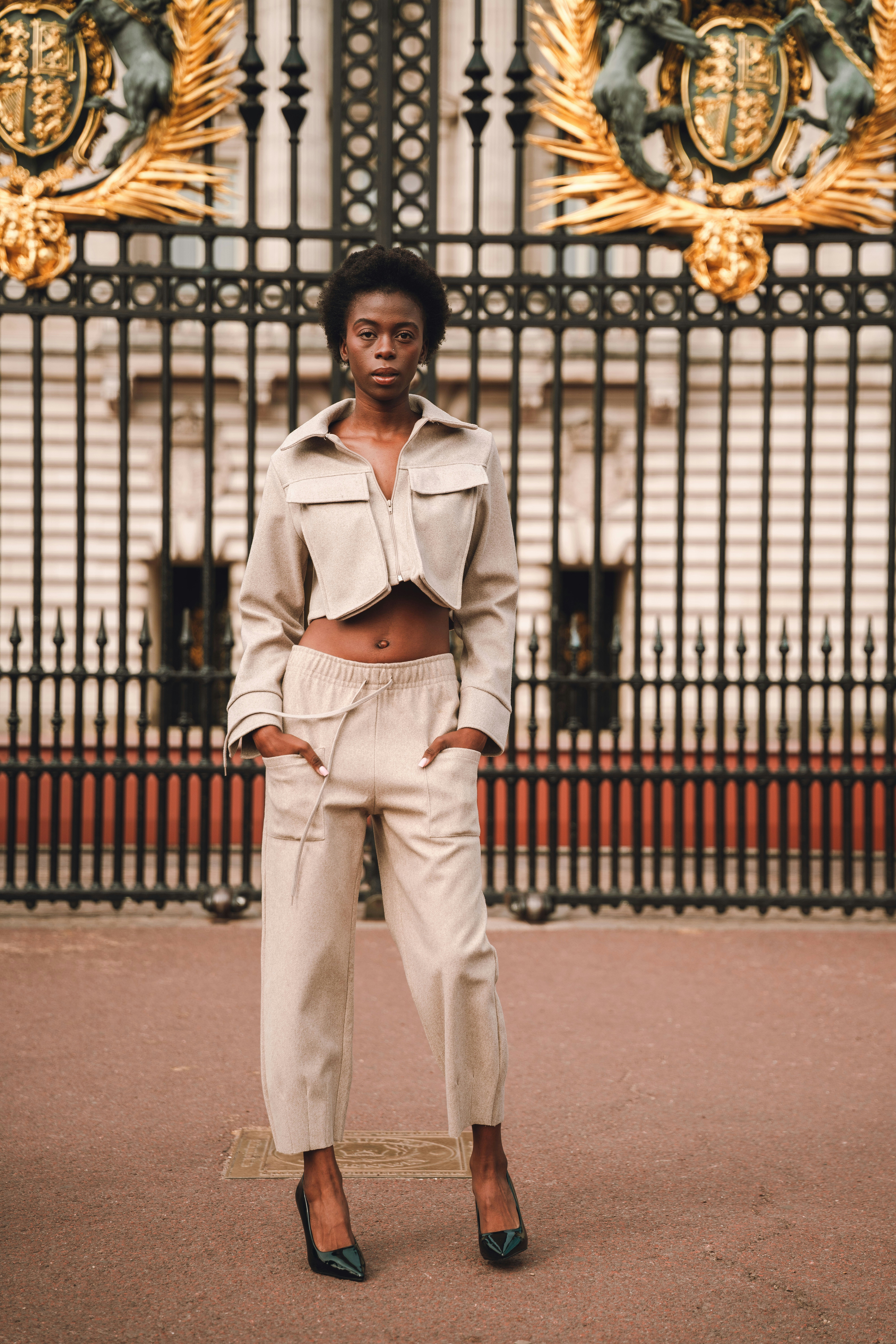 A woman poses in front of ornate gates. photo – Free Female model Image ...
