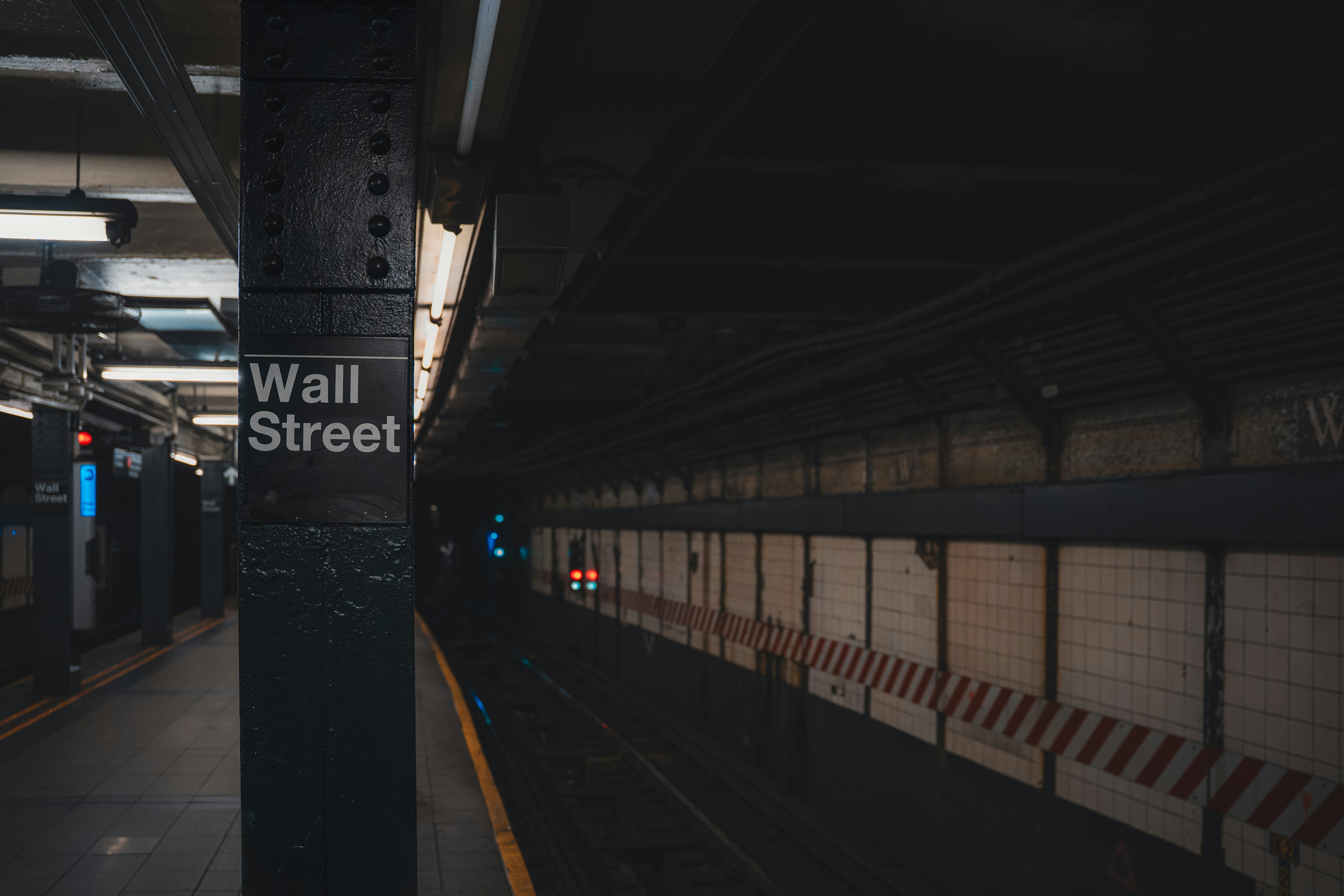 The wall street subway station platform is dark. photo – Free Building ...
