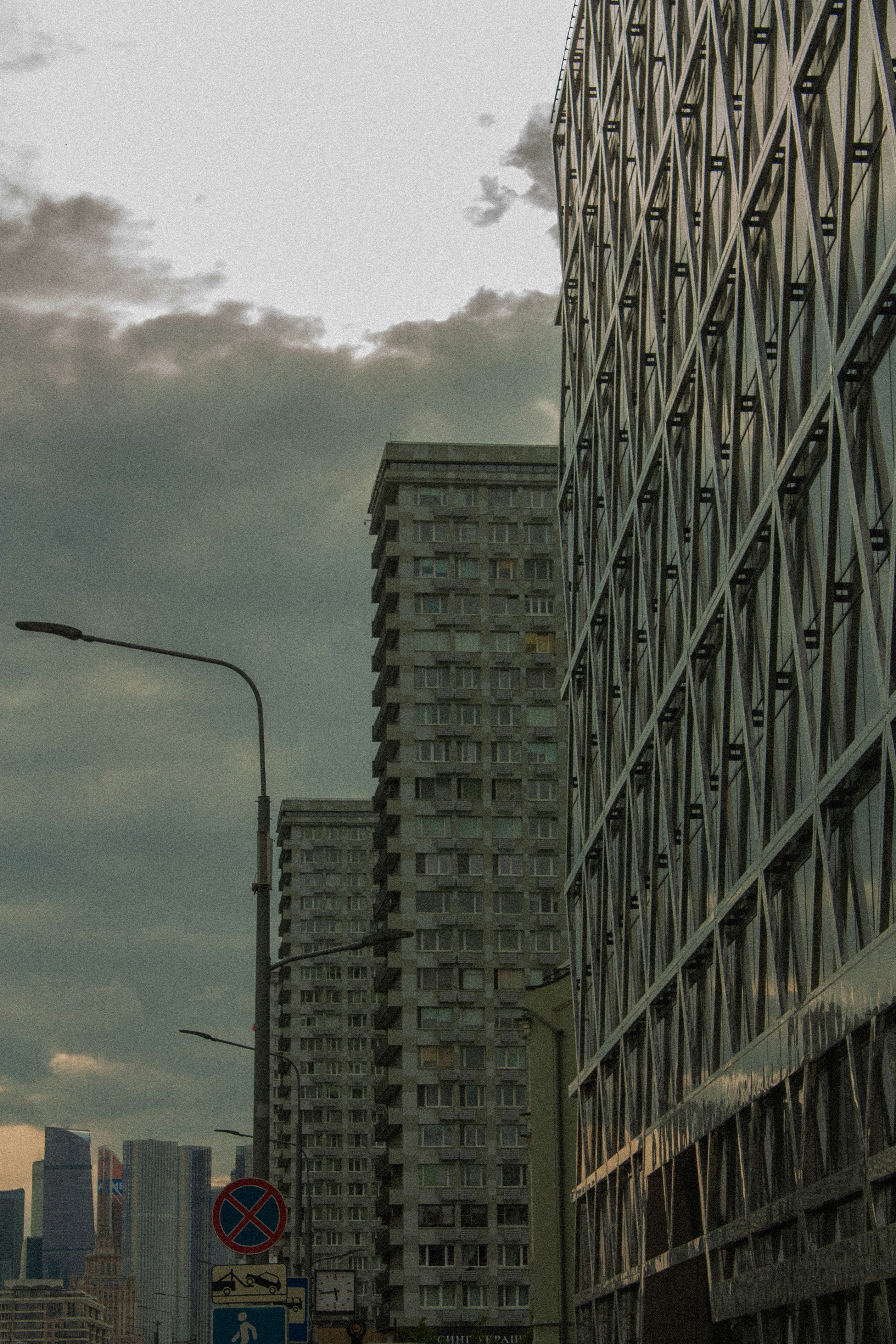 Skyscrapers and cloudy skies dominate the city landscape.
