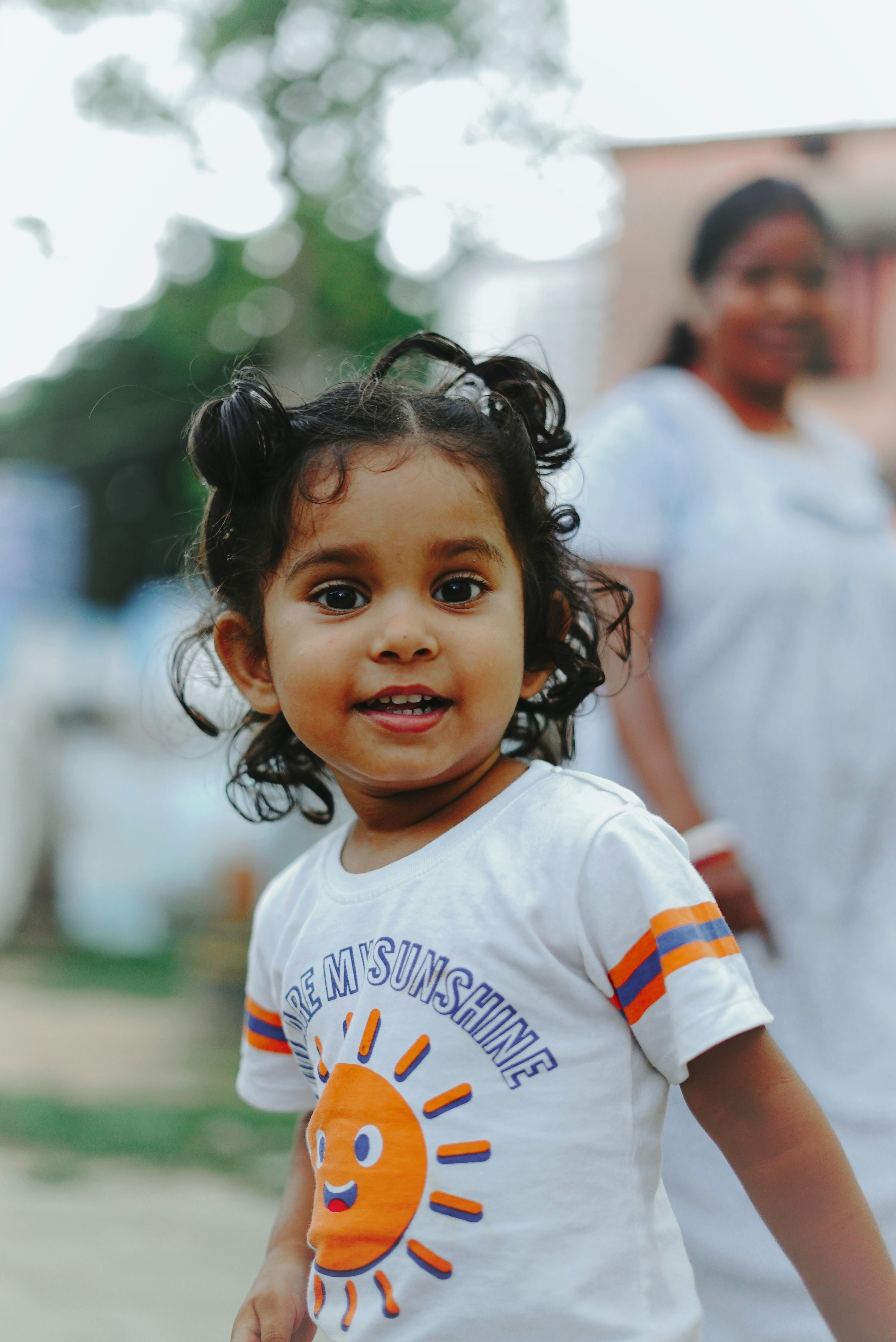 Cute little girl smiles at the camera. photo – Free Indian girl Image on Unsplash
