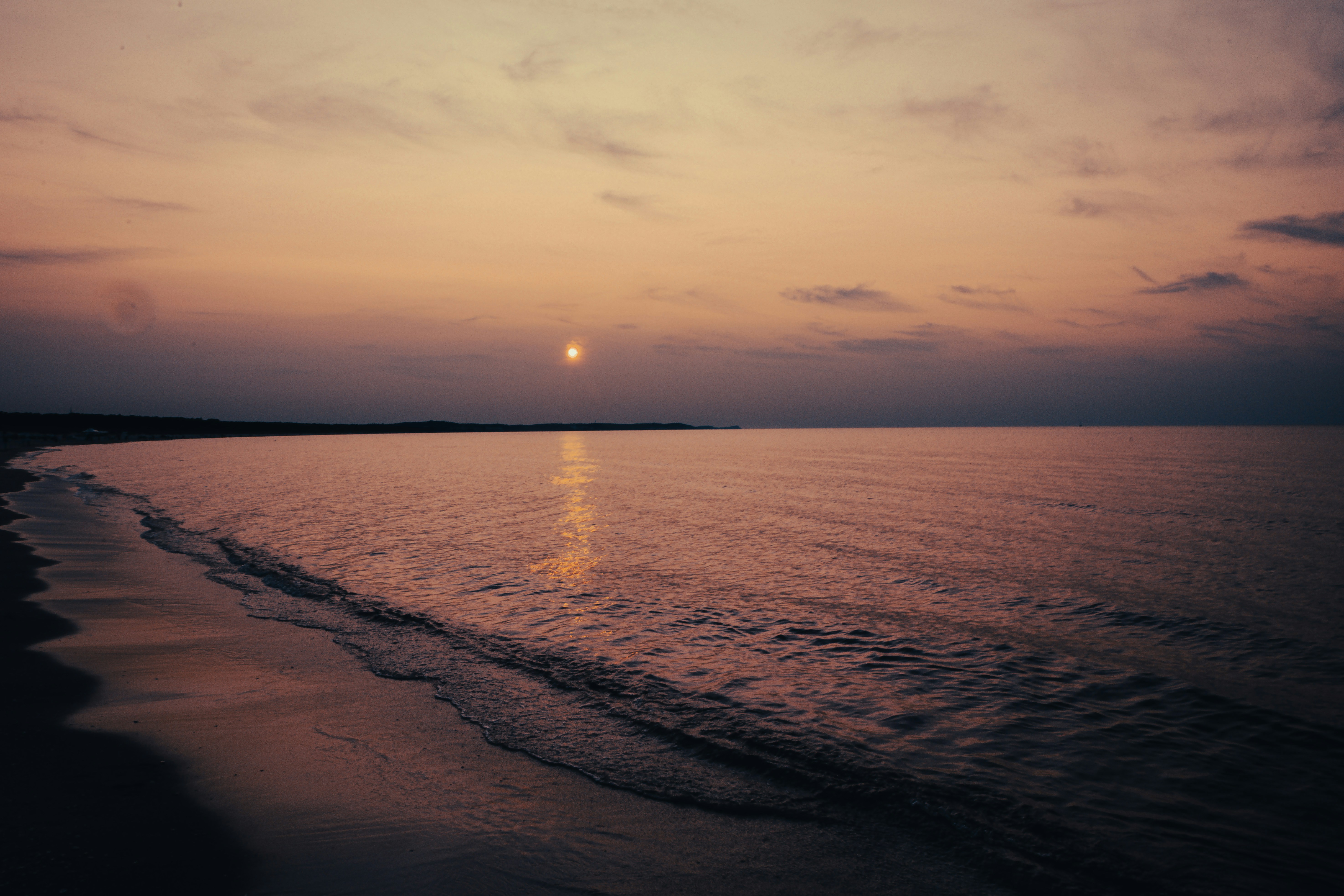 Sunset over a calm ocean.