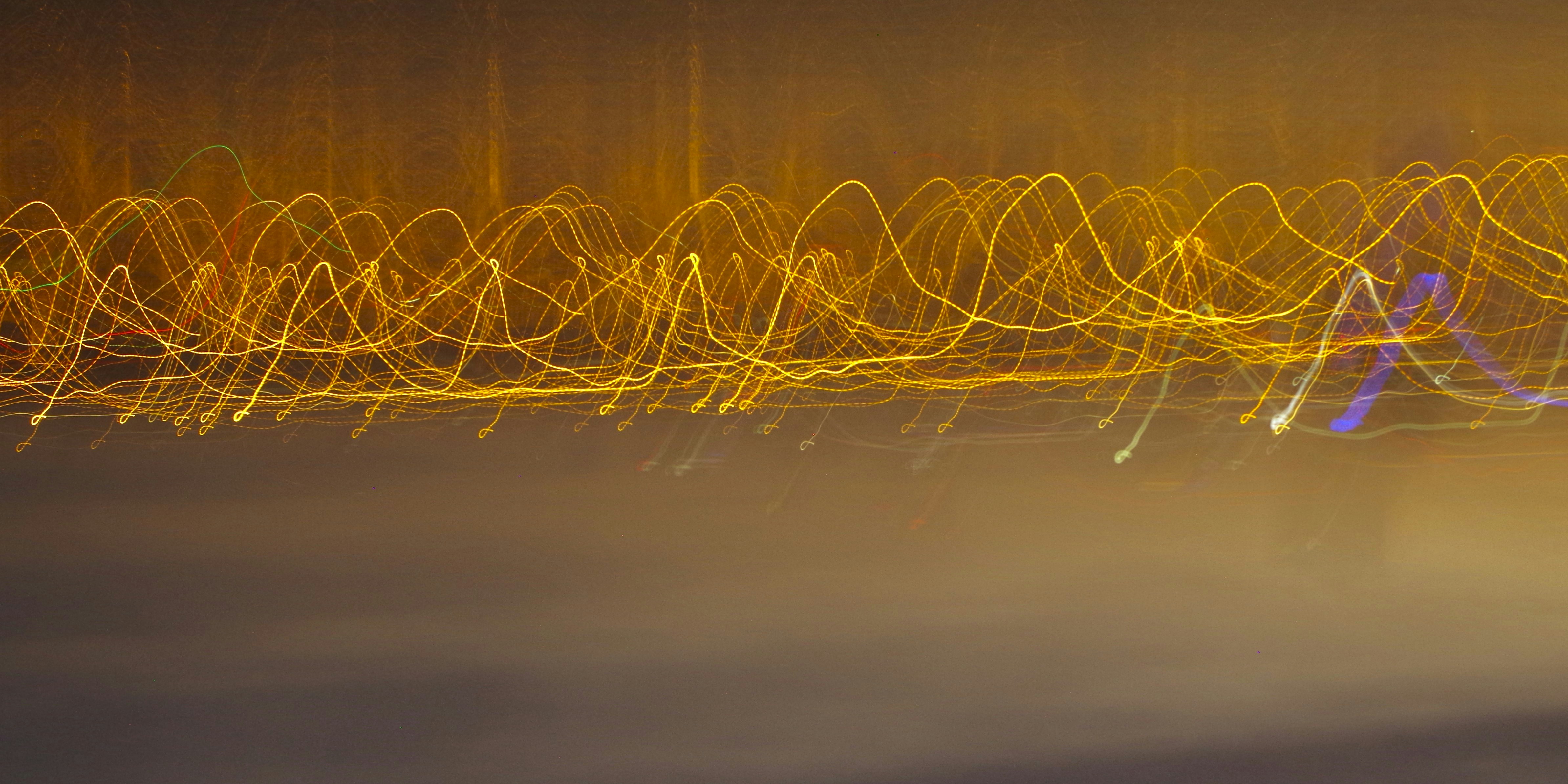 Amber Trails Across a Quiet Night Horizon