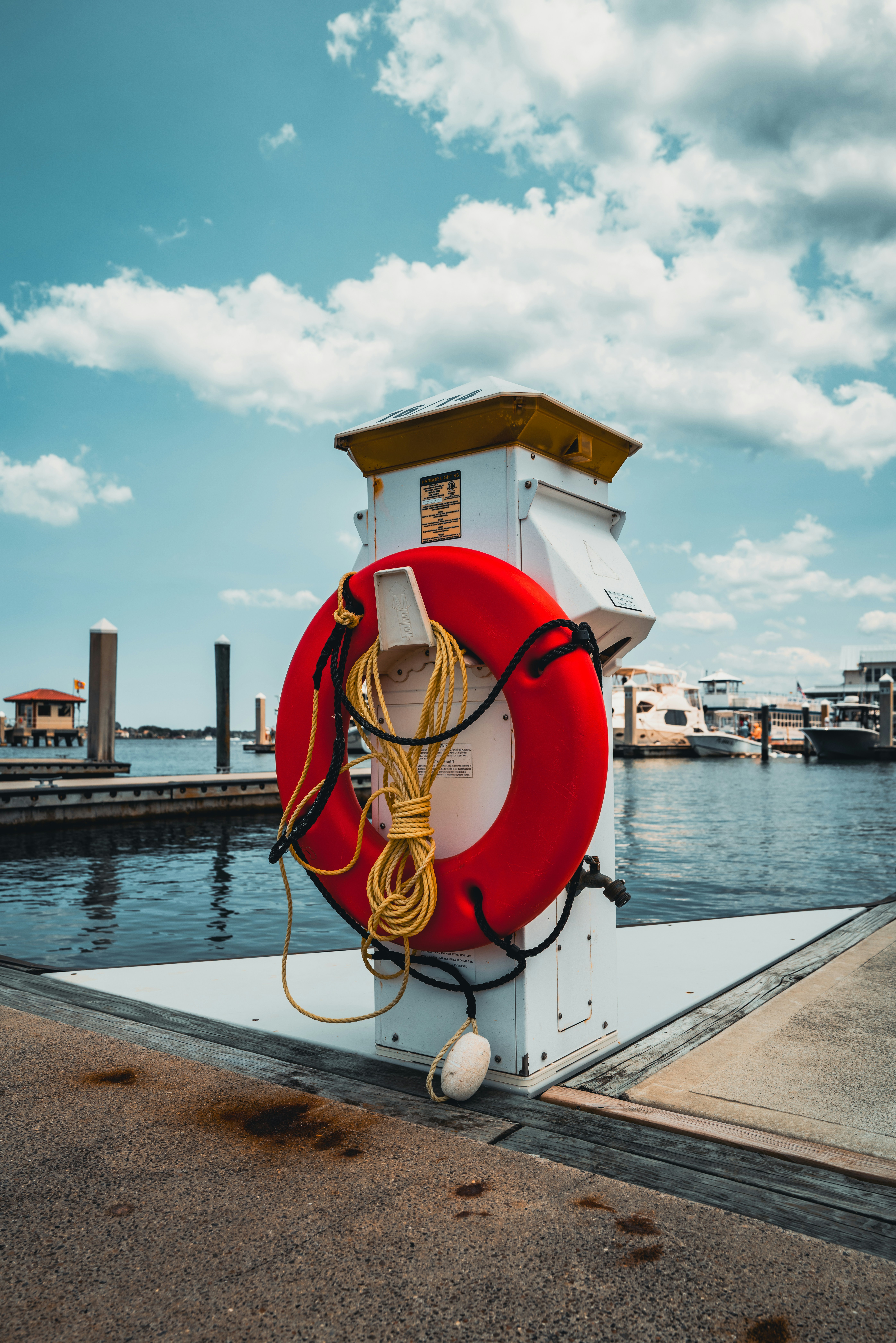 A red life ring is ready by the water. photo – Free Outdoors Image on ...