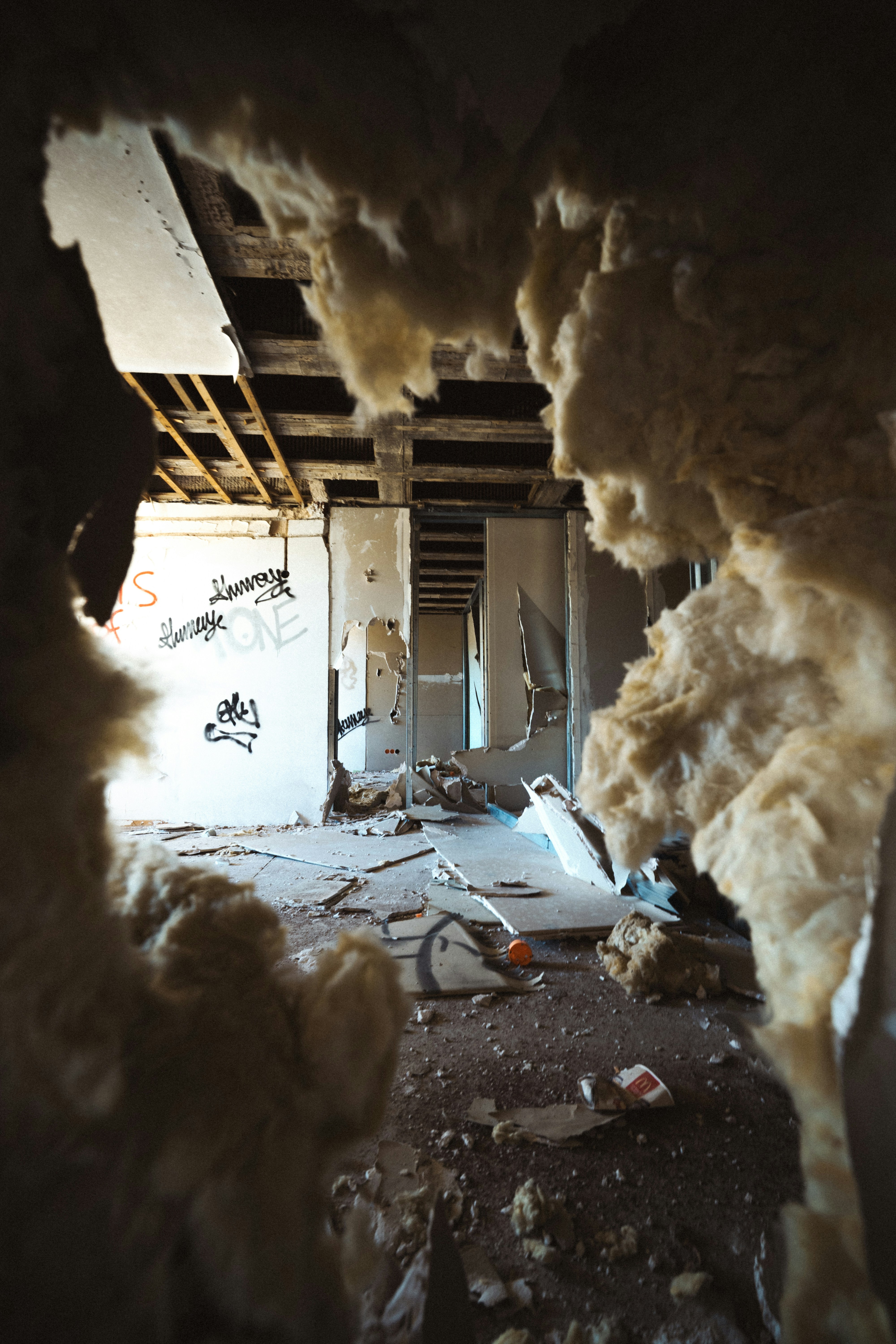 Gutted Hallway: Light Streaks through Ruined Walls