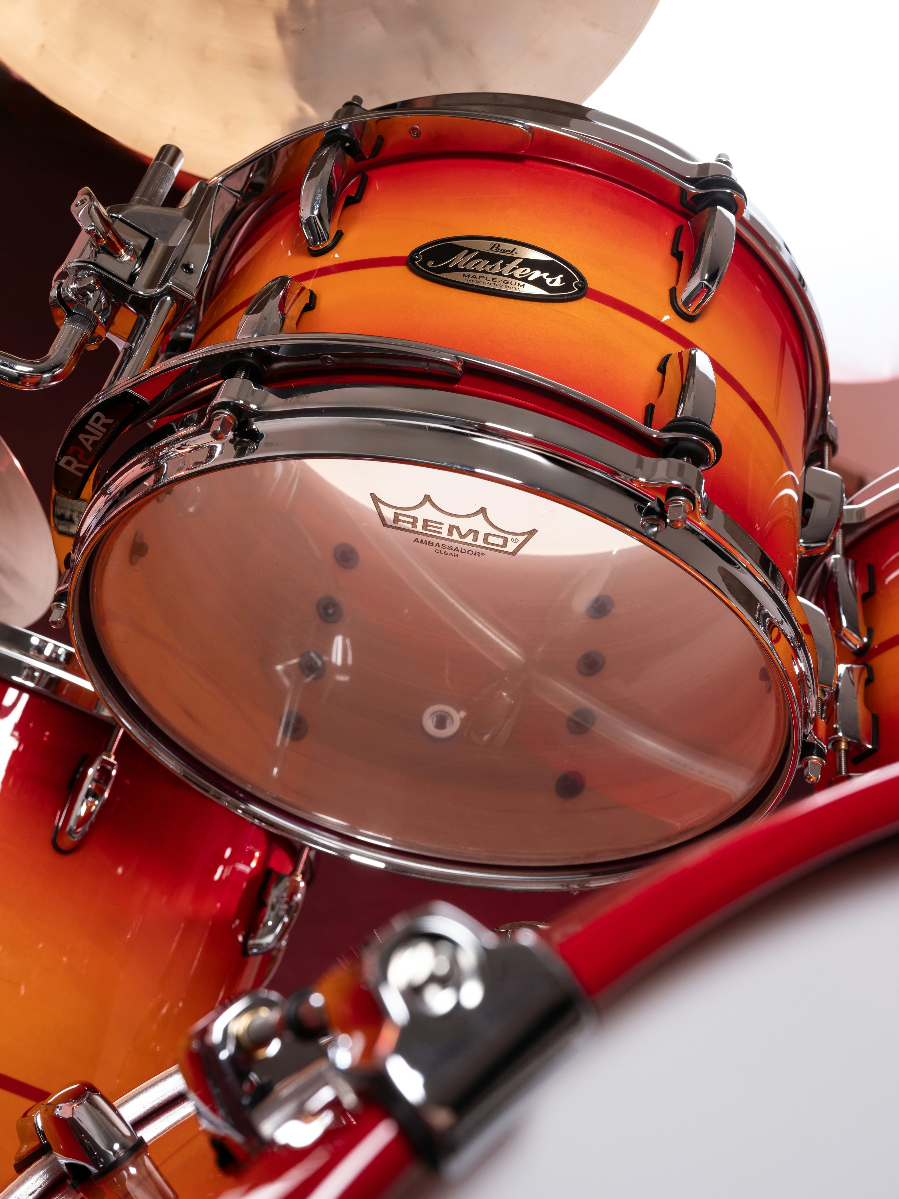 Sunburst Bass Drum Macro: chrome gleam and the Remo logo in focus