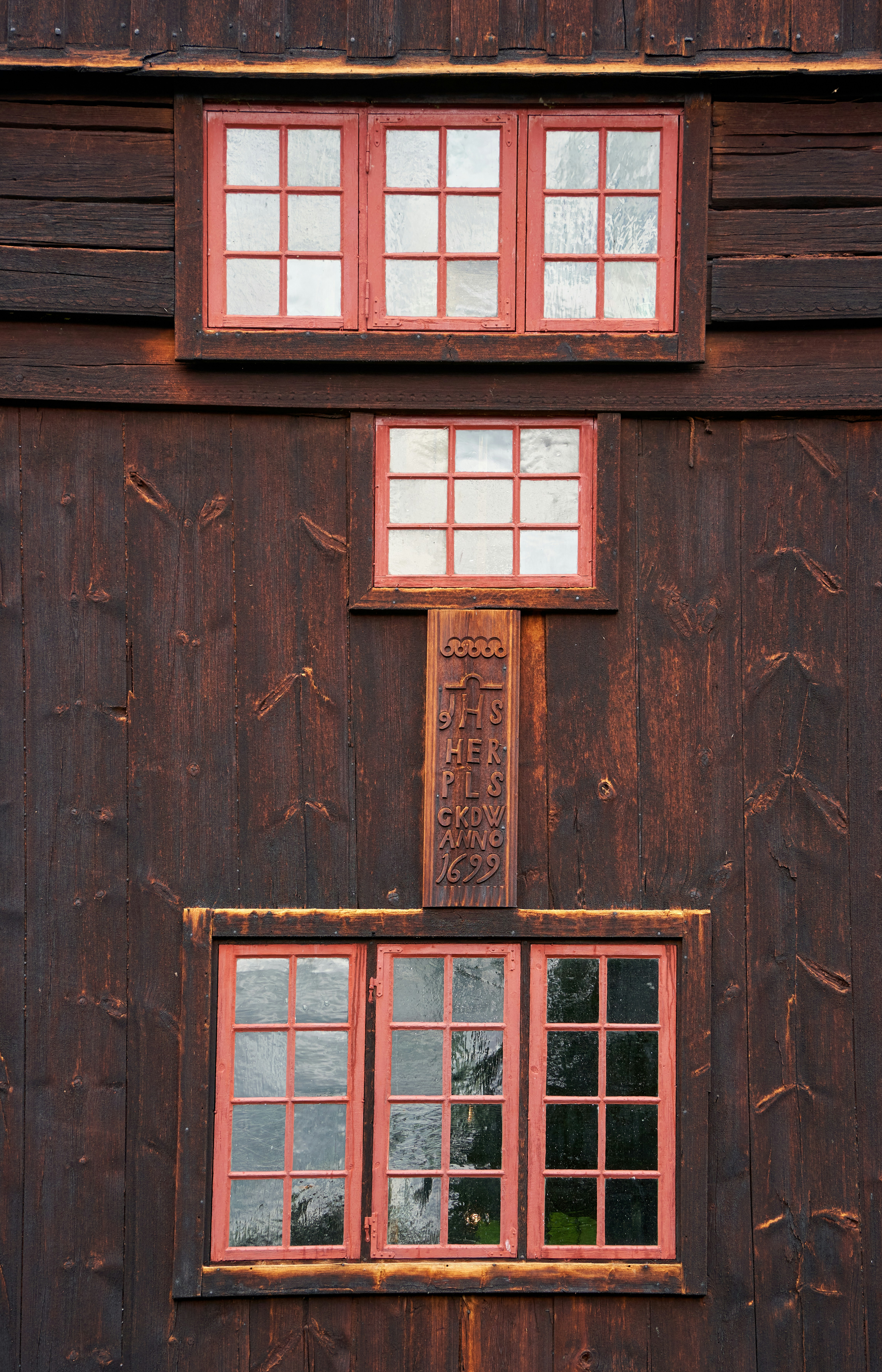 Red-framed windows on a dark wooden building. photo – Free Norway Image ...