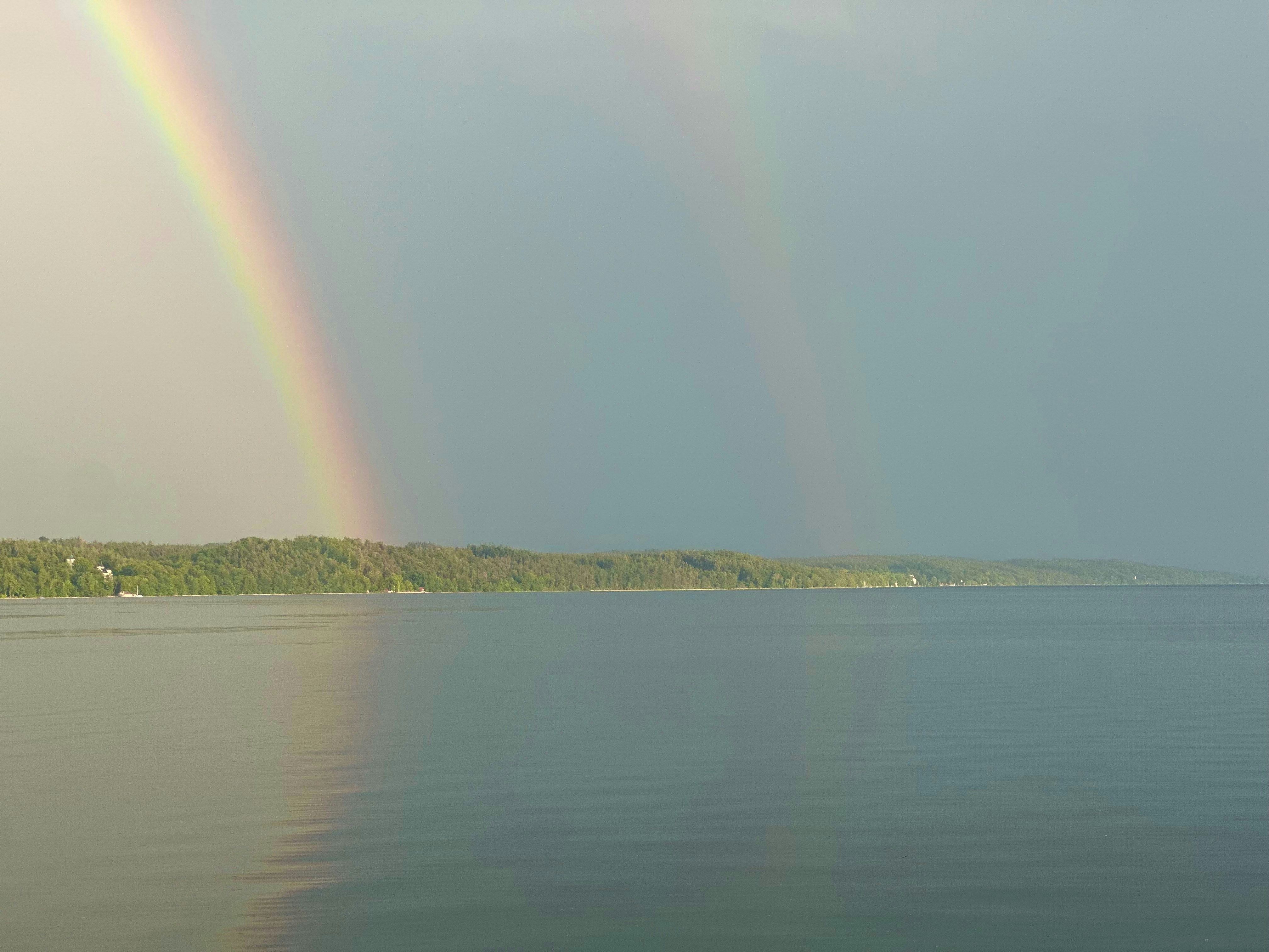 Whispers of Color Over Calm Waters
