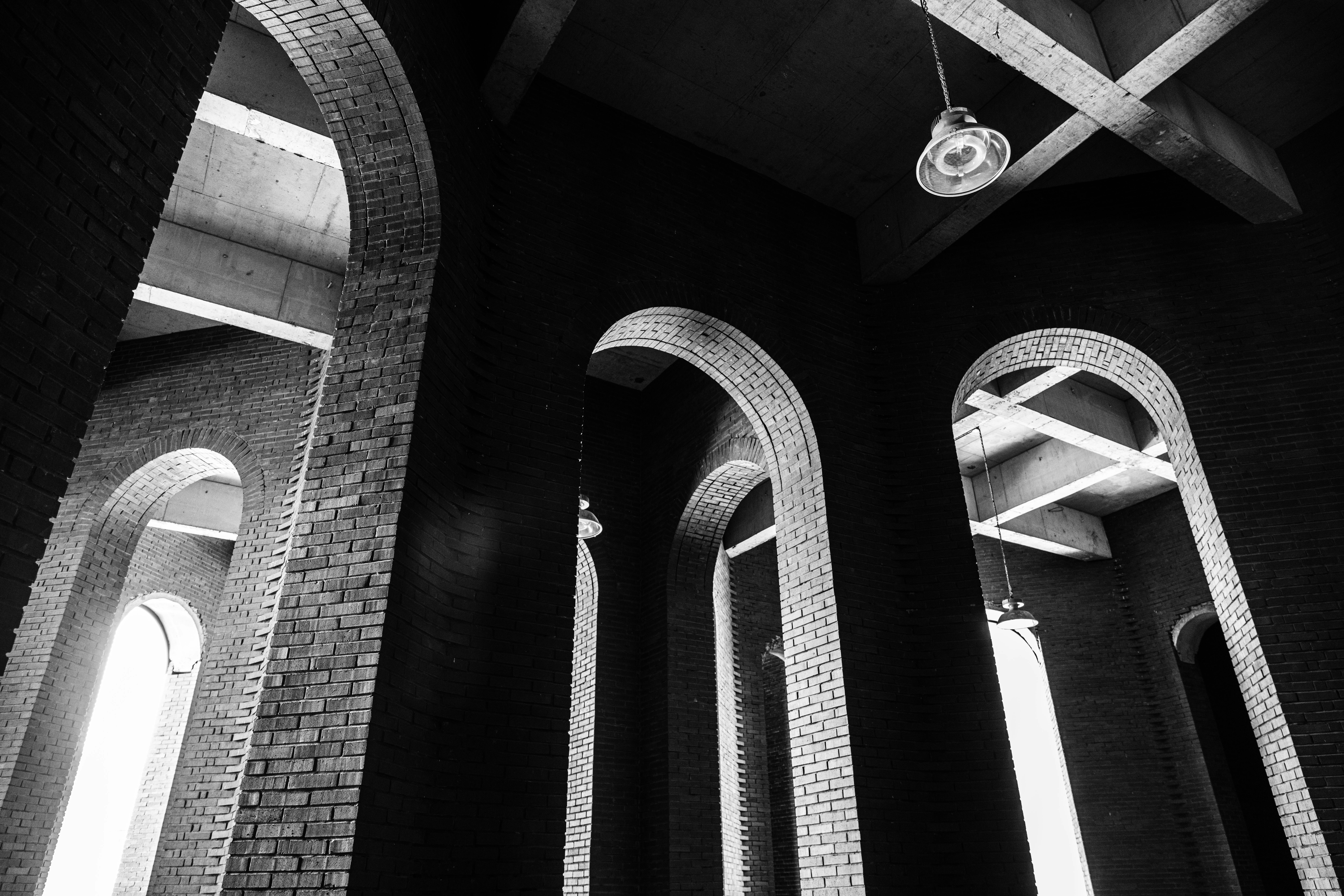 Arches and shadows create a dramatic architectural scene. photo – Free ...