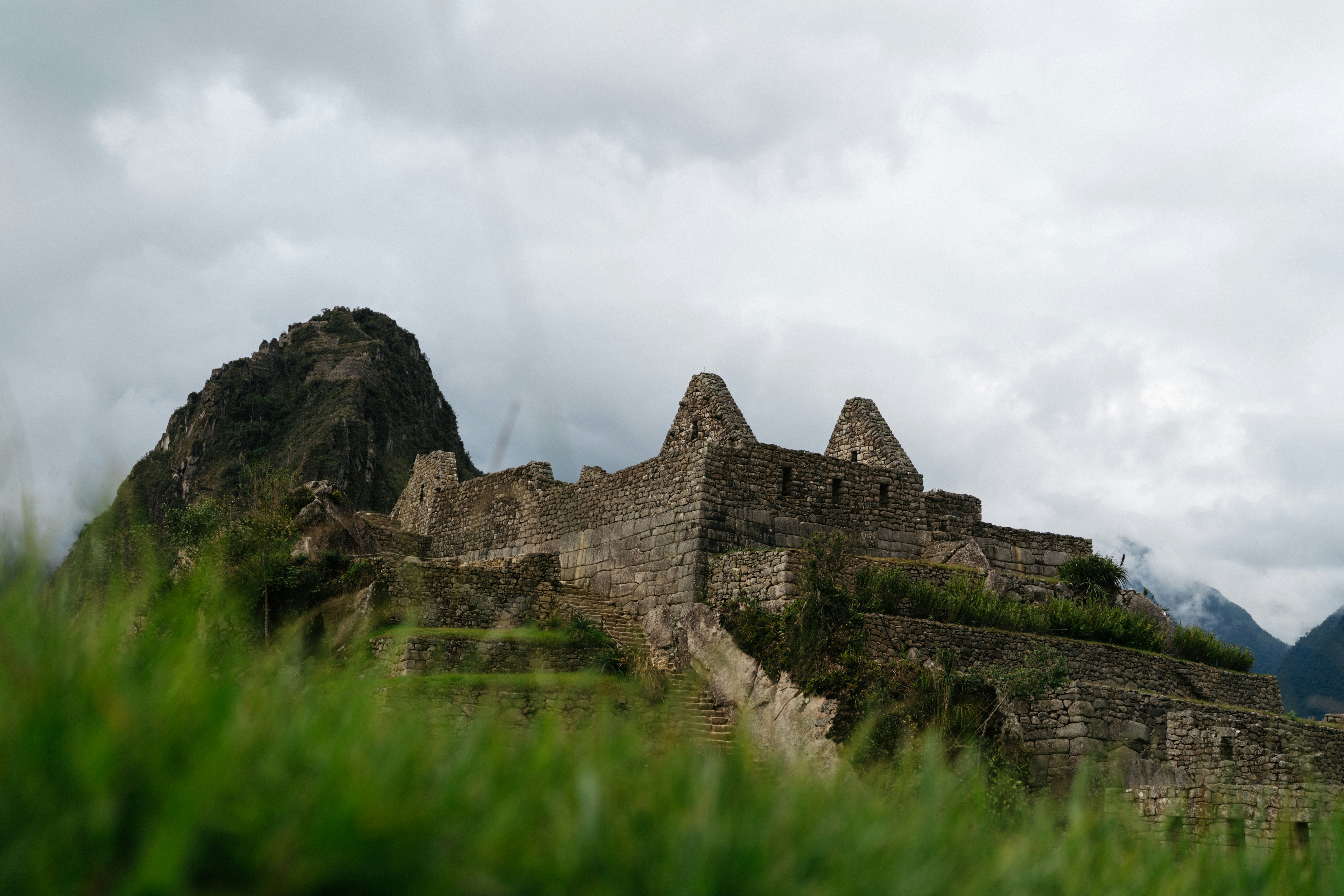 Machu picchu ruins appear under a cloudy sky. photo – Free Castle Image ...