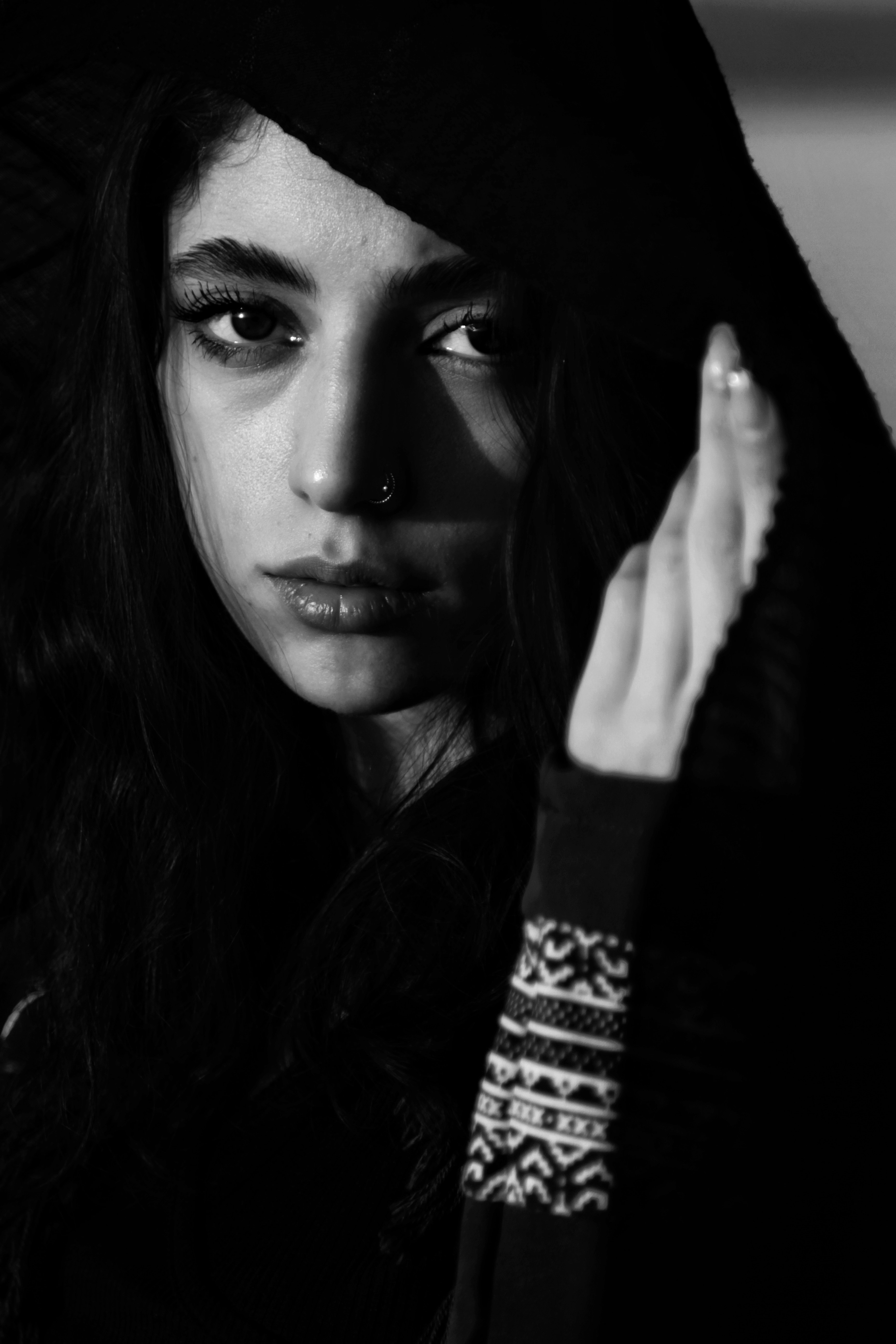 A young woman poses, looking directly at viewer. photo – Free Portrait ...