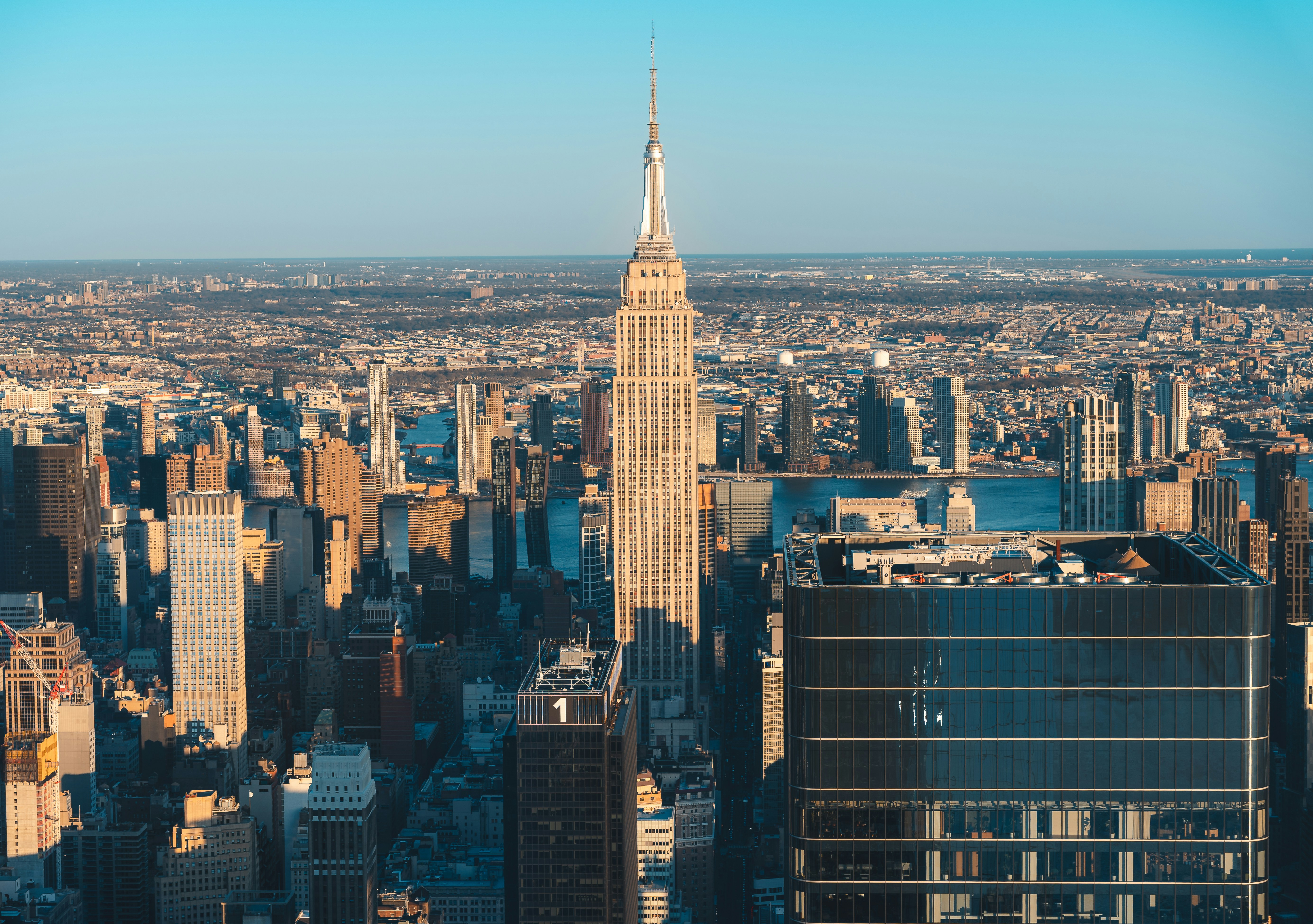The empire state building towers over new york city. photo – Free ...