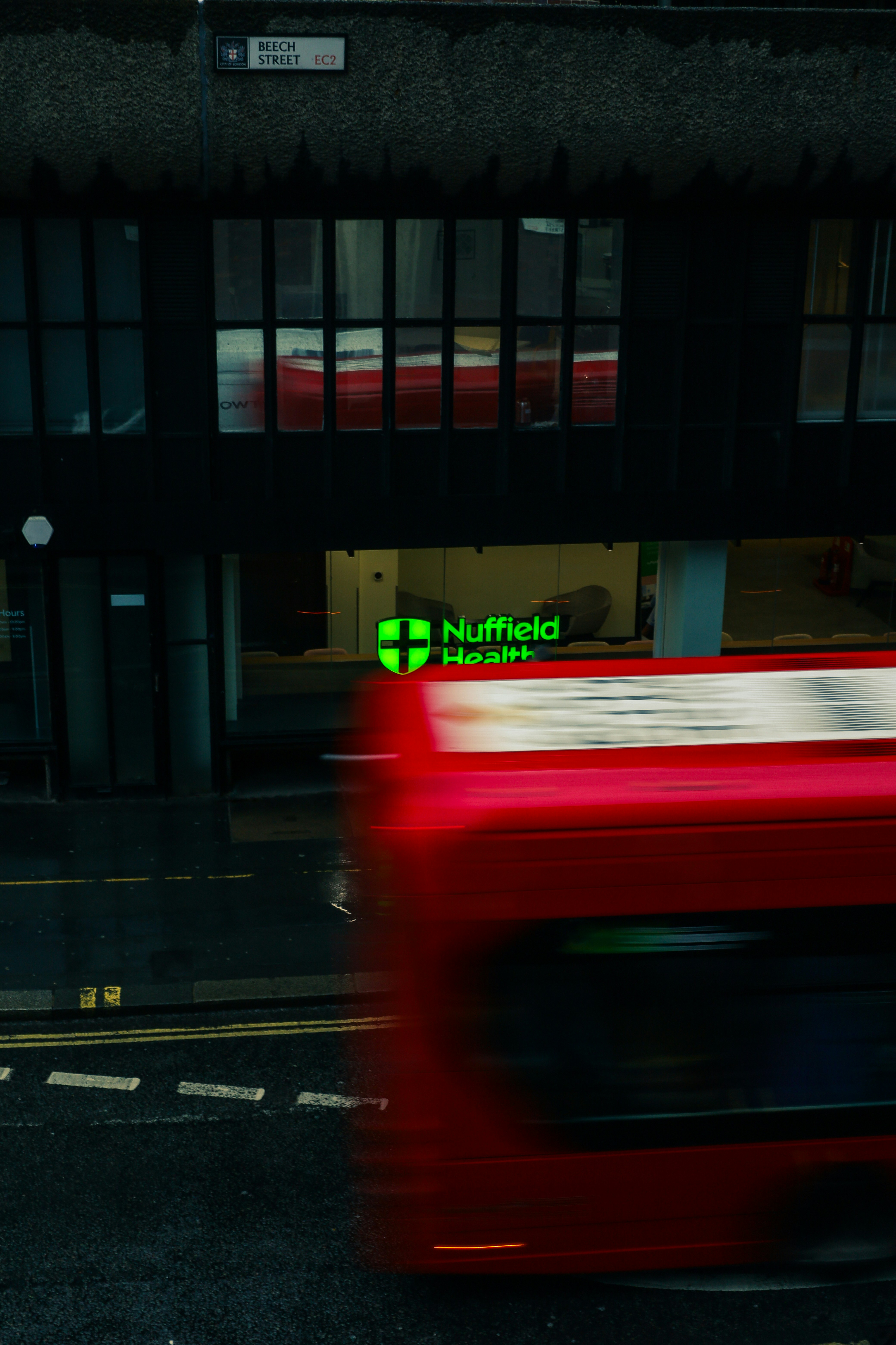 A red london bus passes the nuffield health clinic. photo – Free Car ...