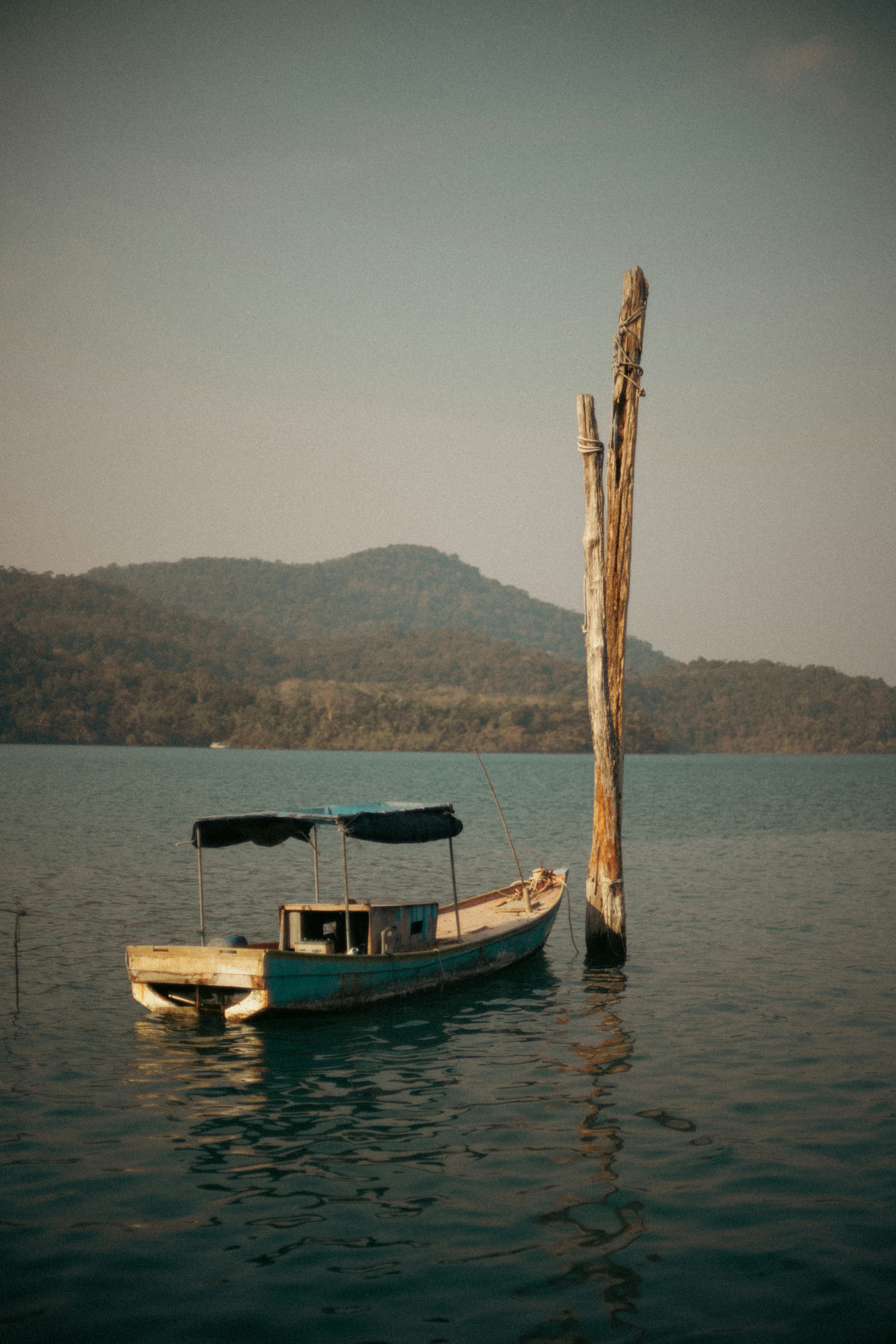 Solitary Drift: A Boat's Quiet Respite