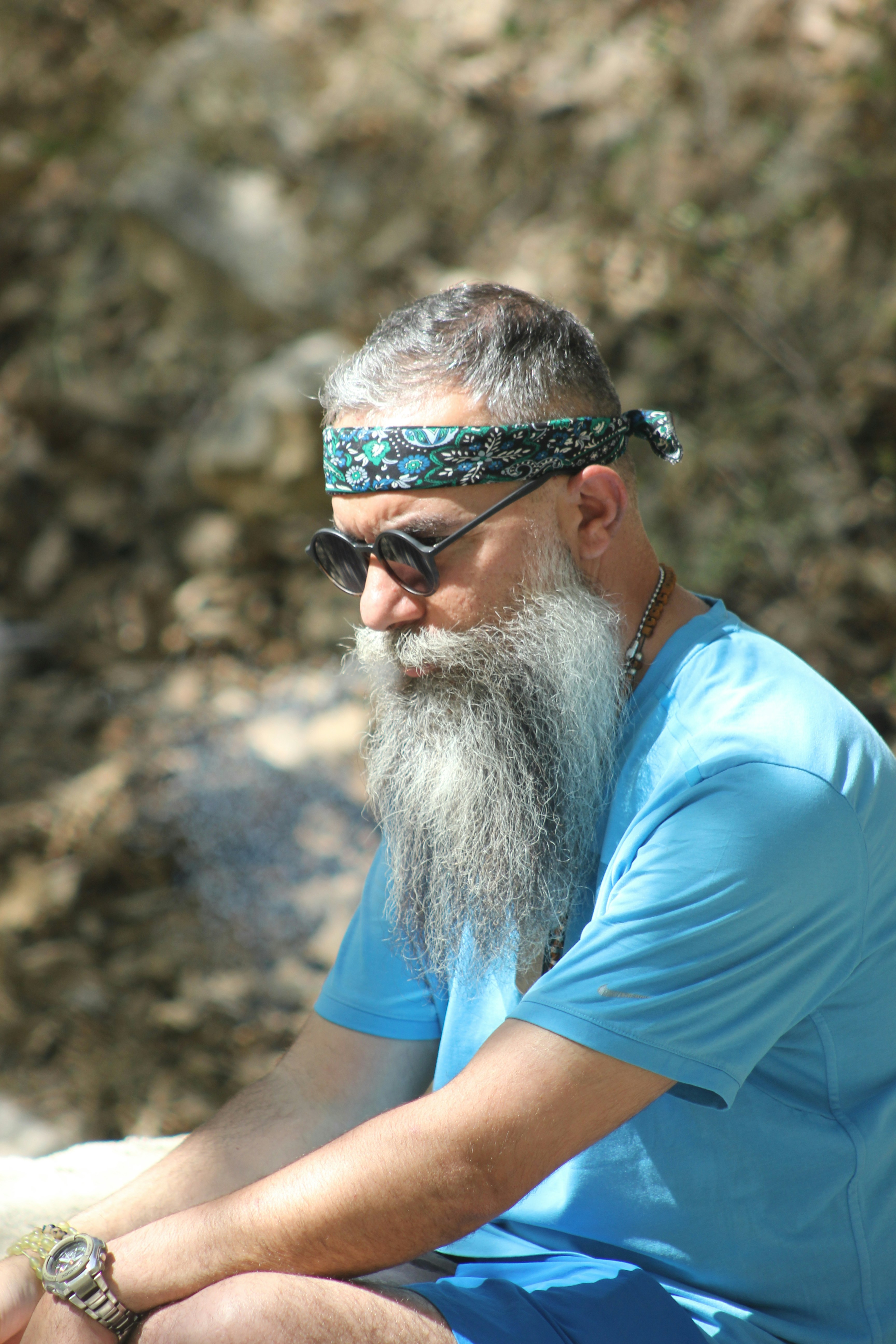 Bearded sage in blue under sunlight by the river