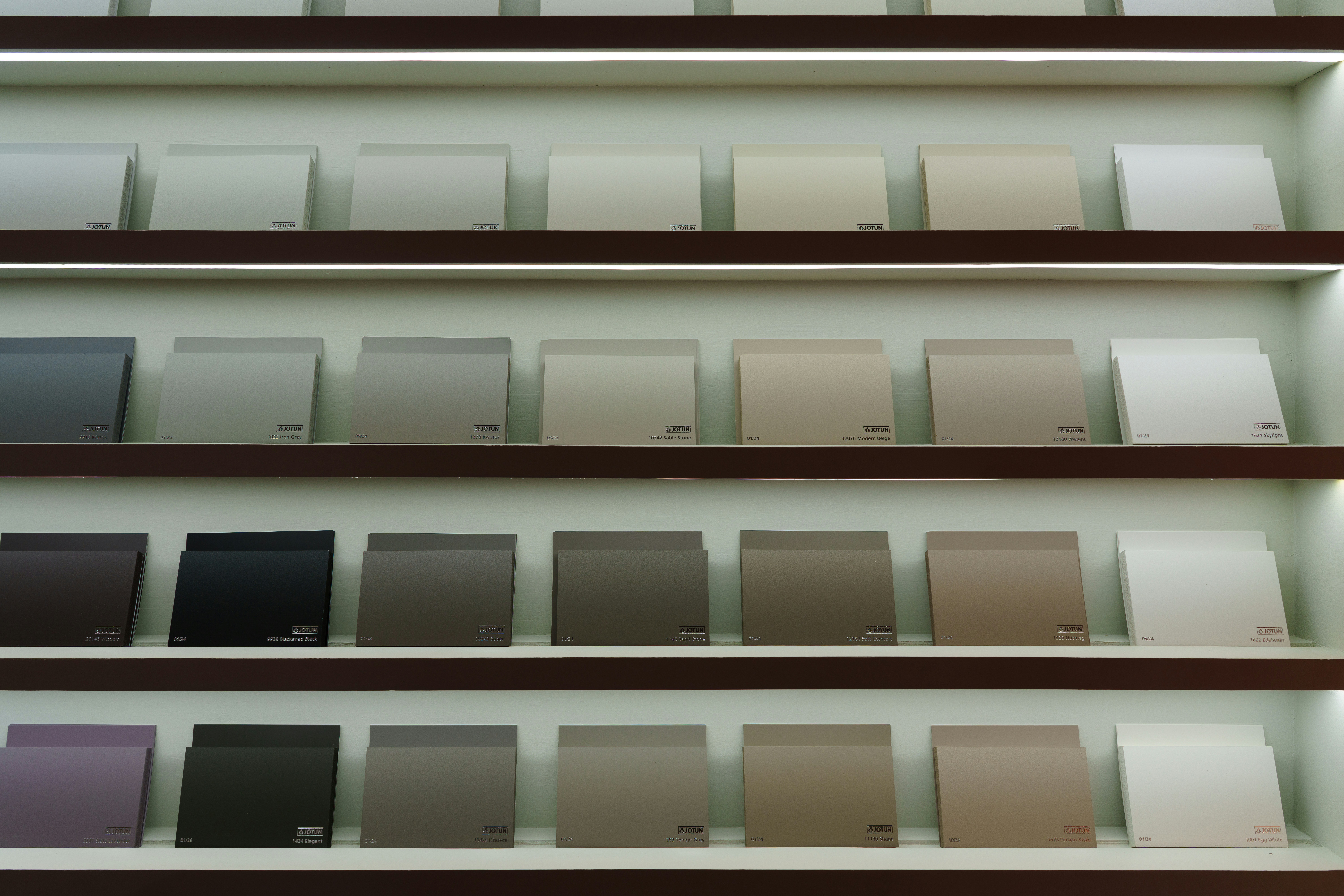 Sample paint color swatches are displayed on shelves.