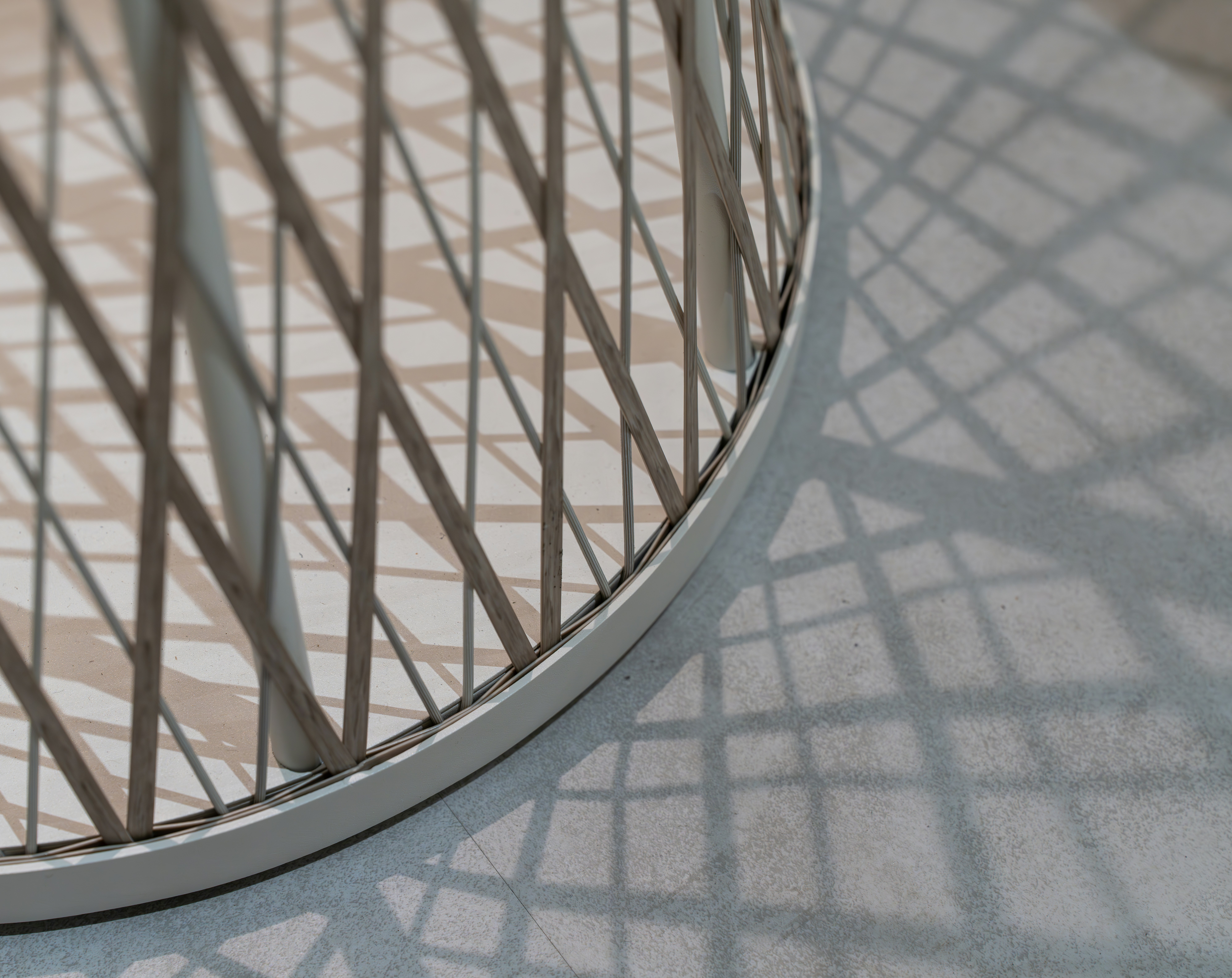 Circular Lattice Play: Shadow Grid Cast by a Curved Metal Railing