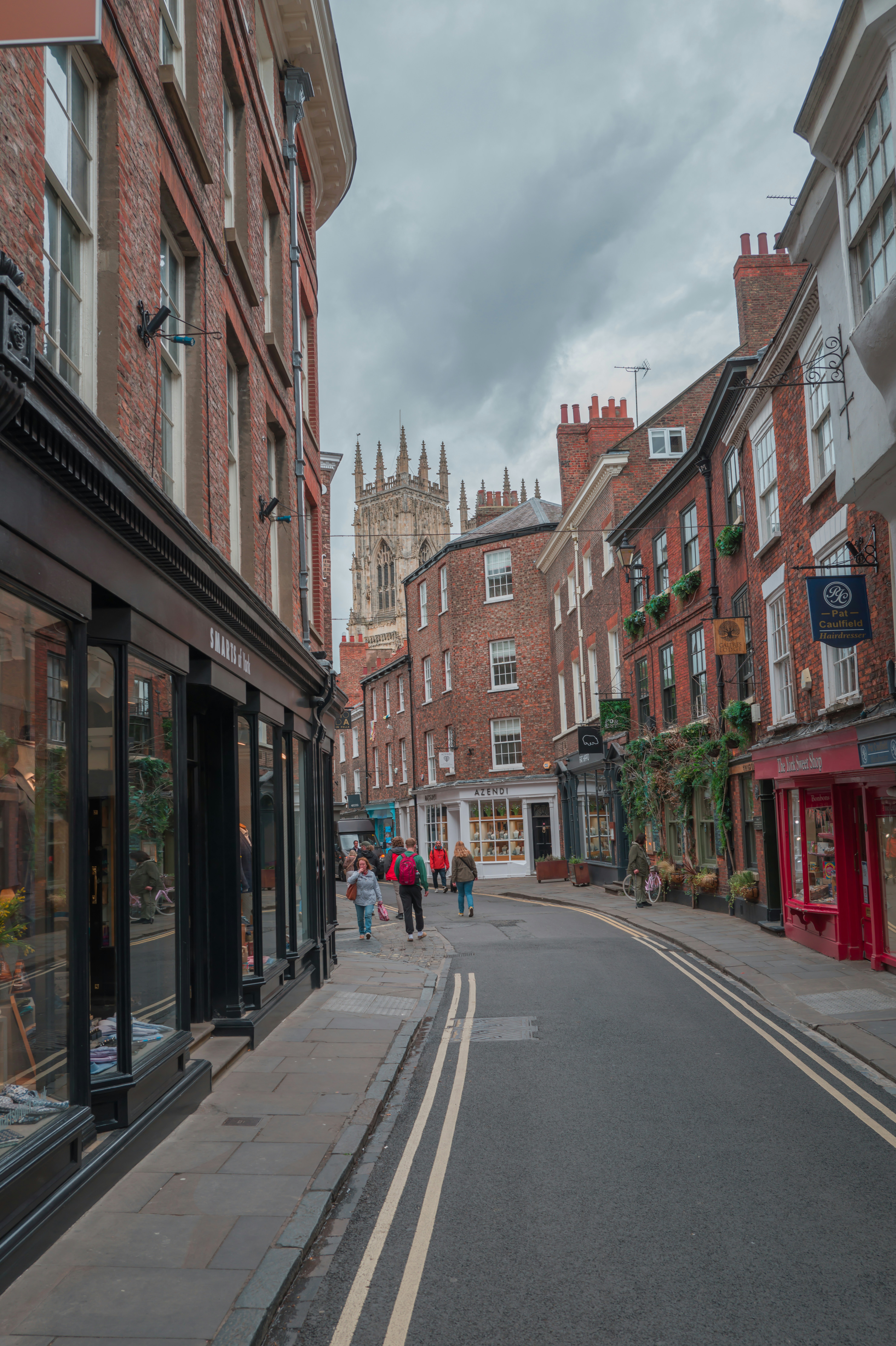 A charming european street scene with people. photo – Free Town Image ...