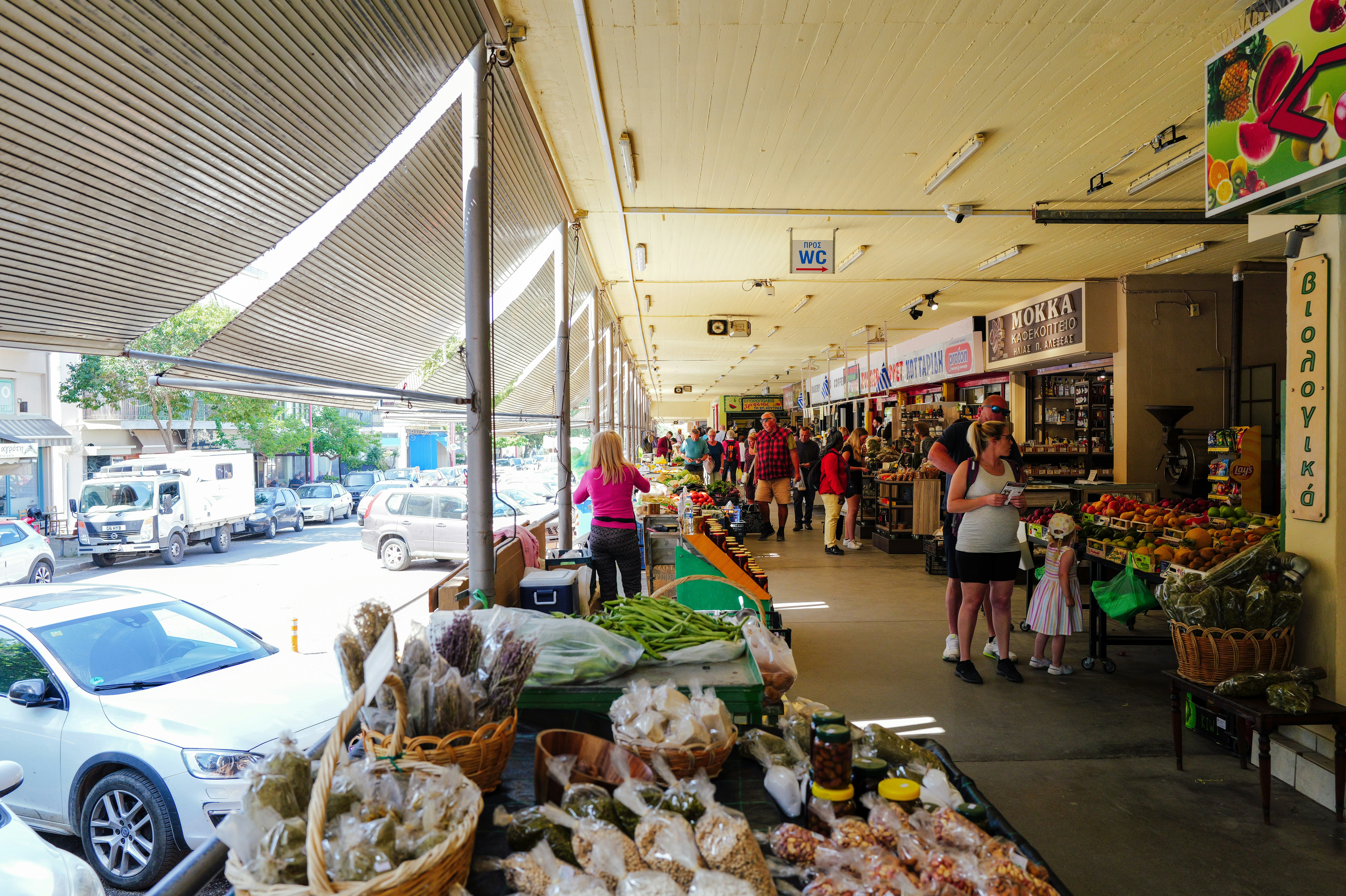 People browse and shop at an open-air market. photo – Free Car Image on ...