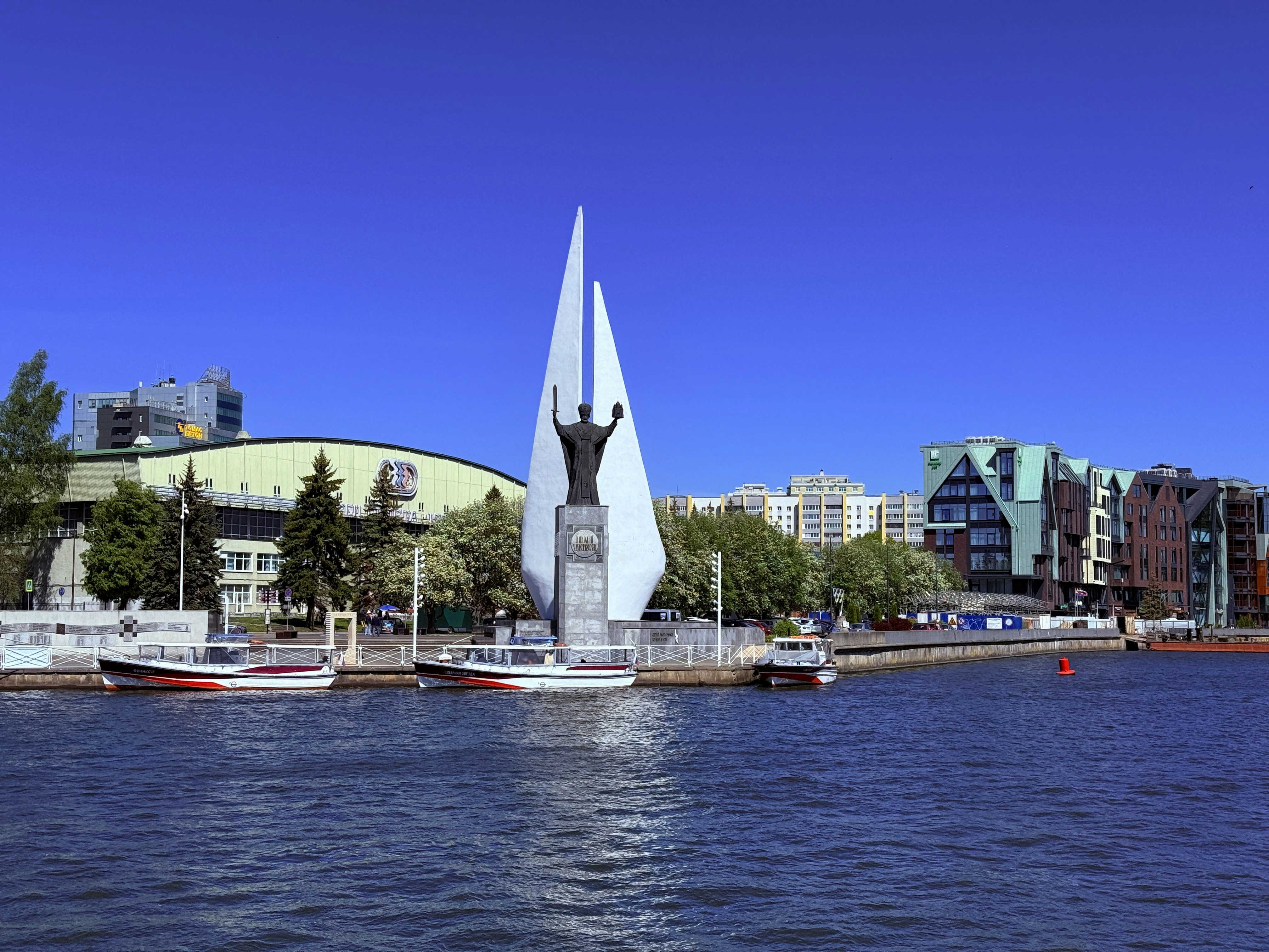 Harbor Prism: The Monument Rising Over a Blue Waterfront
