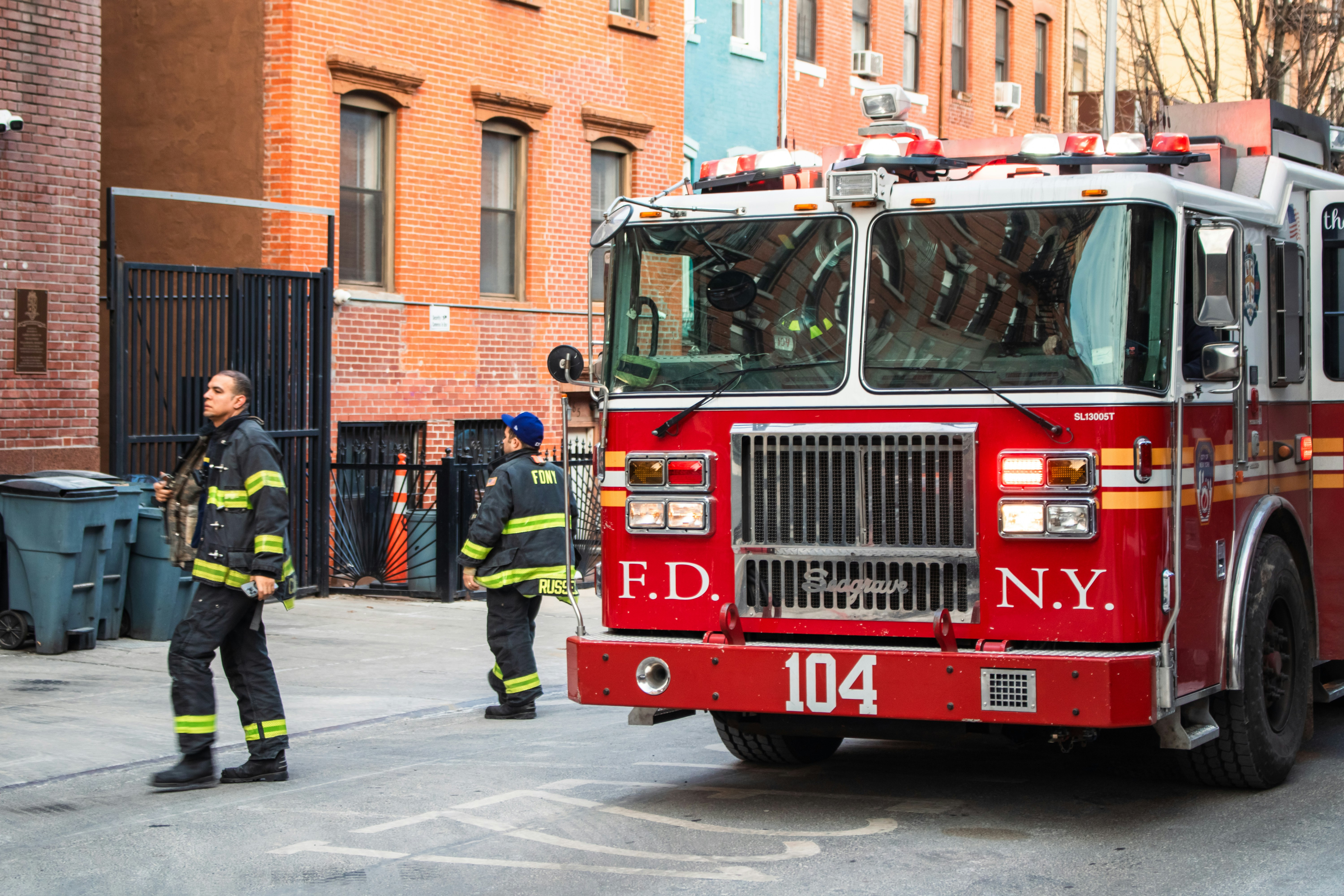 Firefighters and fire truck at a scene. photo – Free City Image on Unsplash