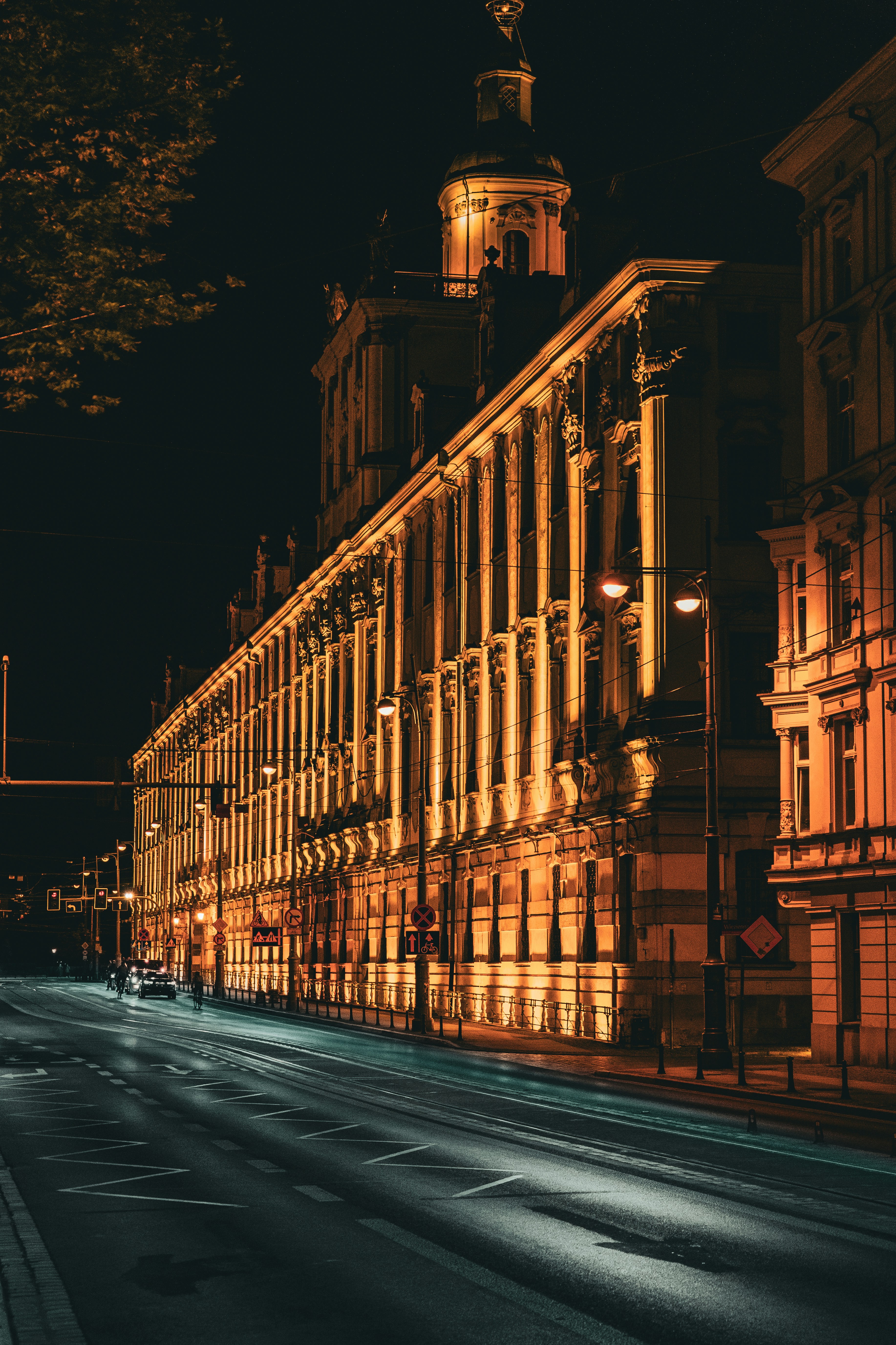 A beautifully lit building at night shines.