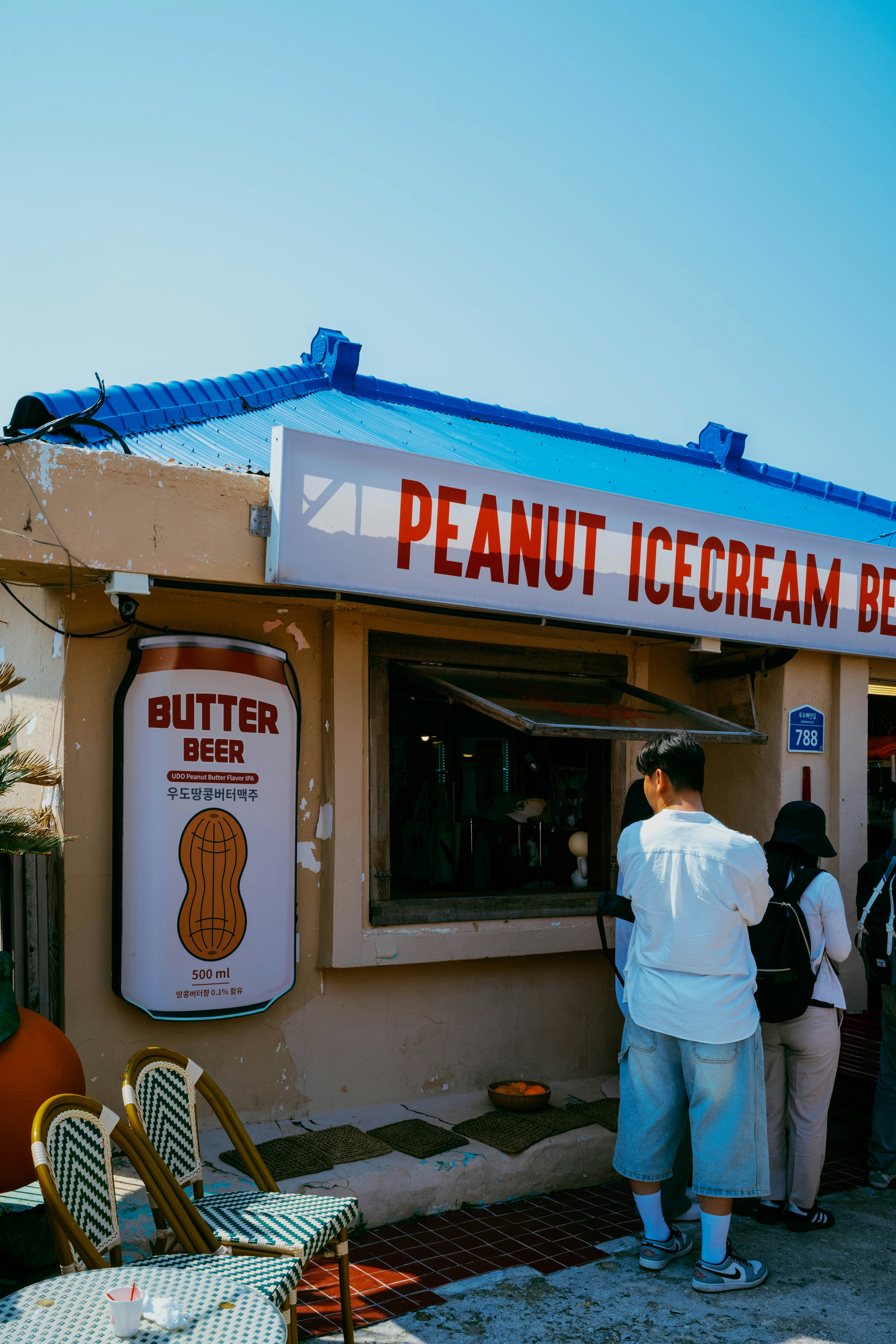 Sunlit Peanut Ice Cream Stand: A Colorful Coastal Street Stop