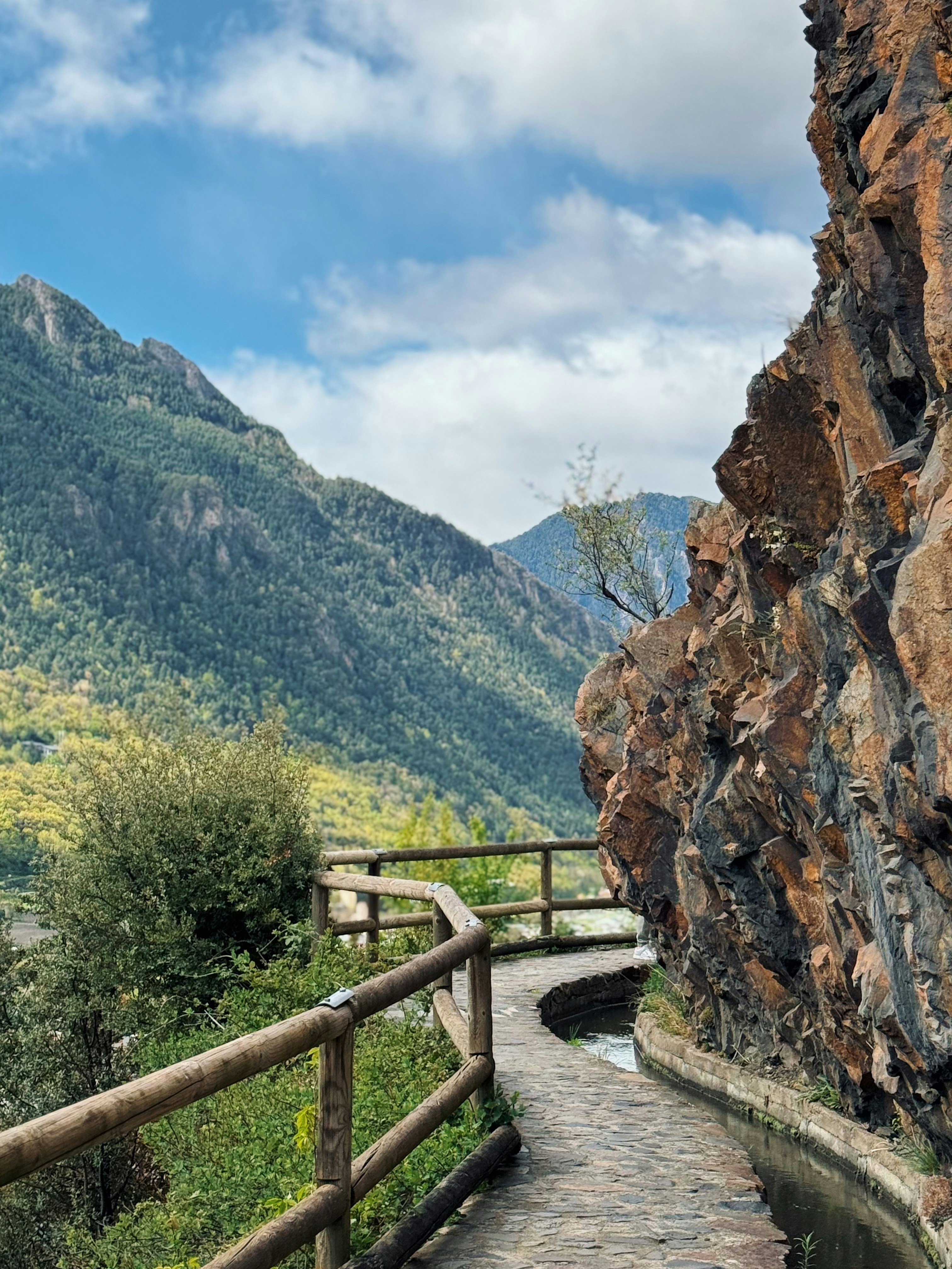 Ridge Path: Cliffside Trail Winding Toward Distant Peaks