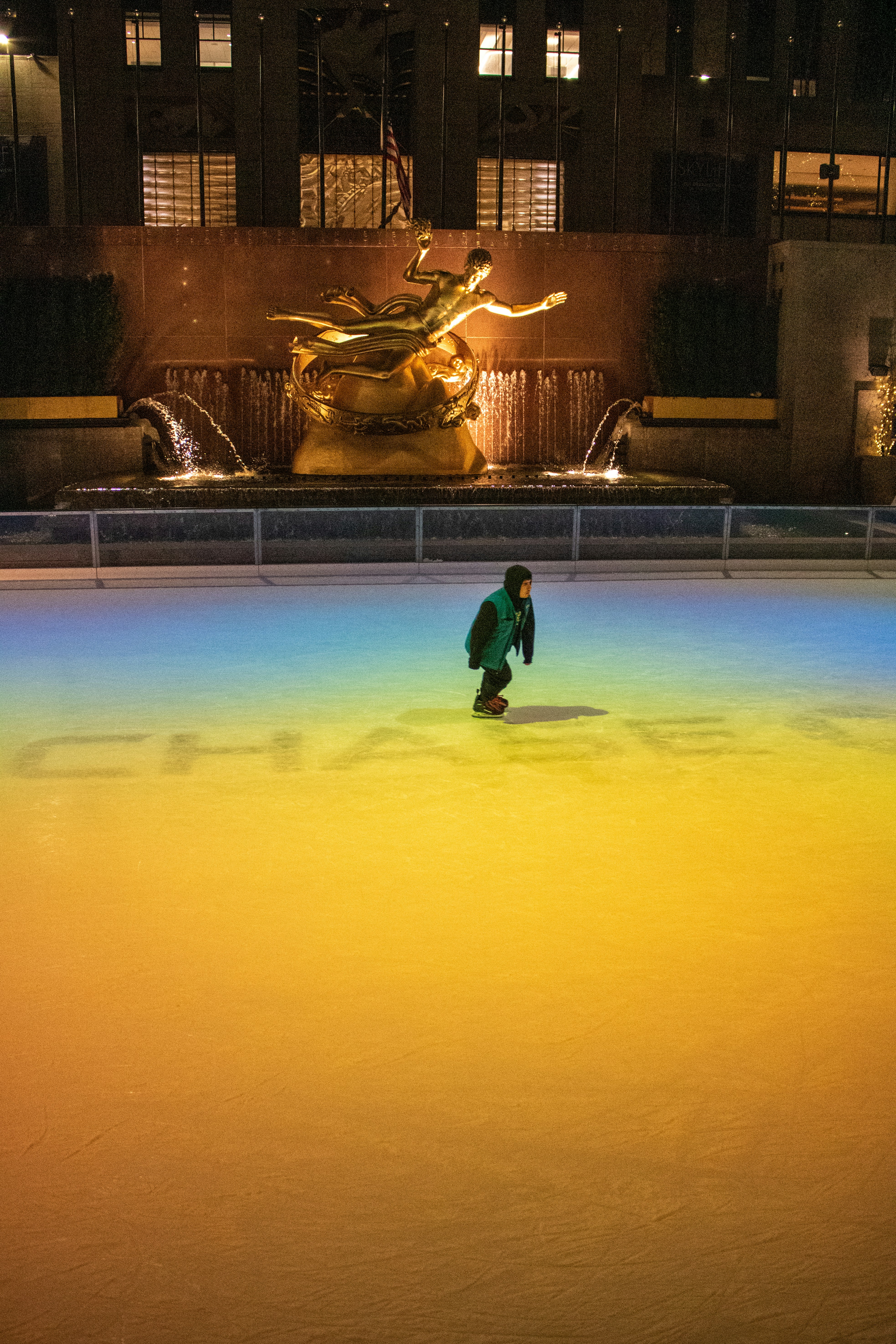 Neon Glide: A lone skater carving color on an urban night ice