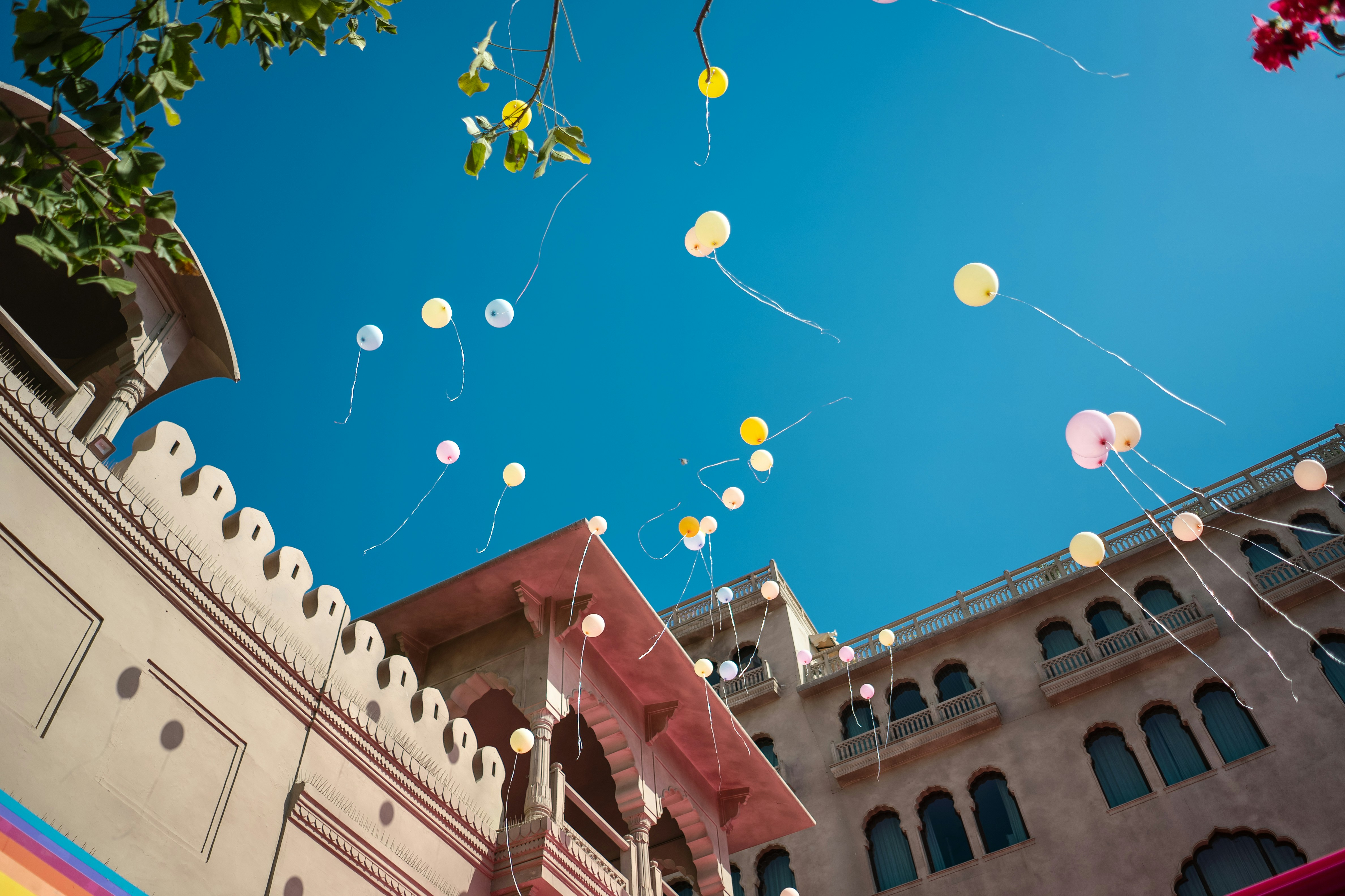 Whimsical Balloon Dance Against a Cerulean Sky