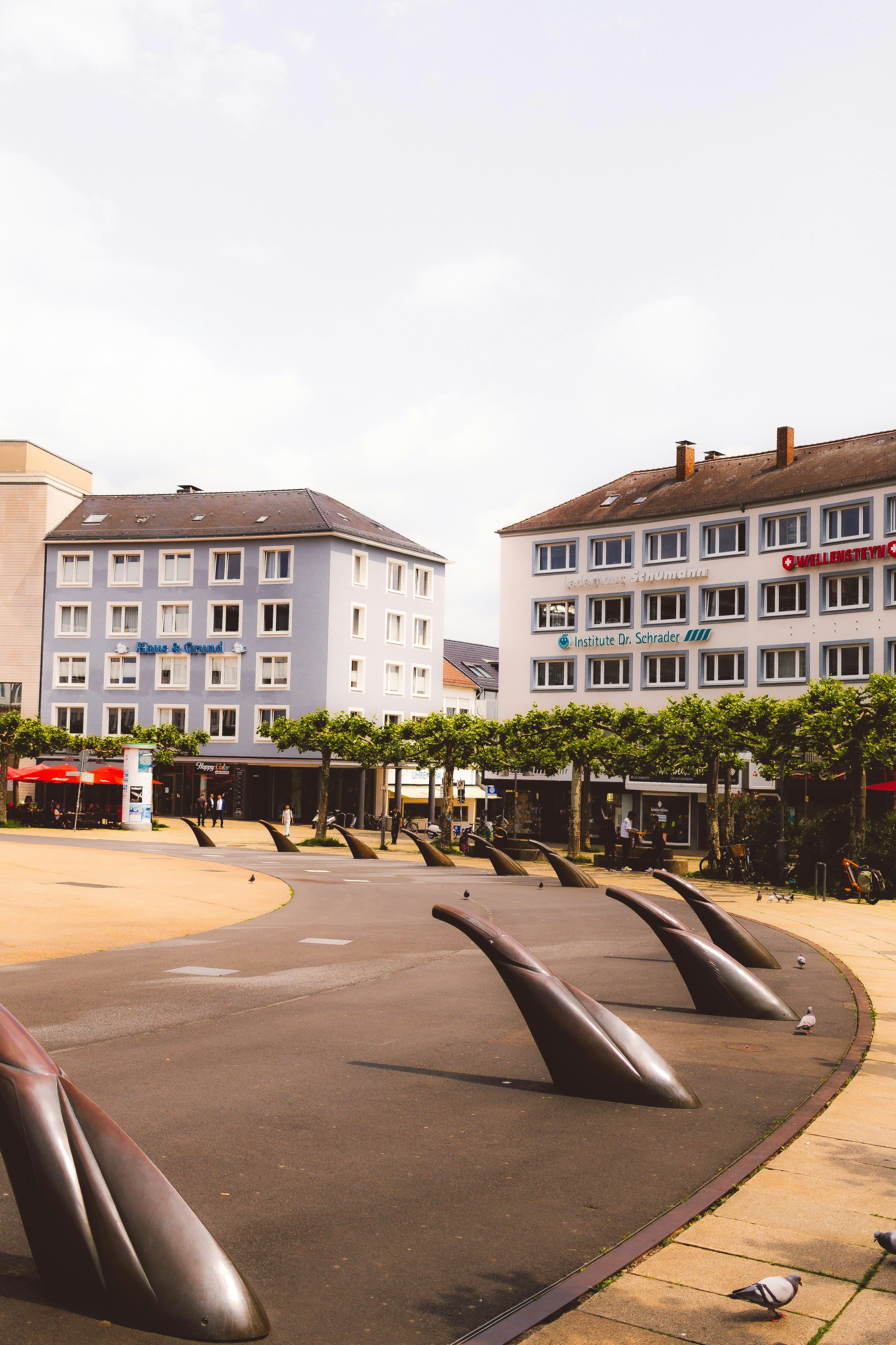 Urban Plaza with Curved Sculptures under a Bright Sky