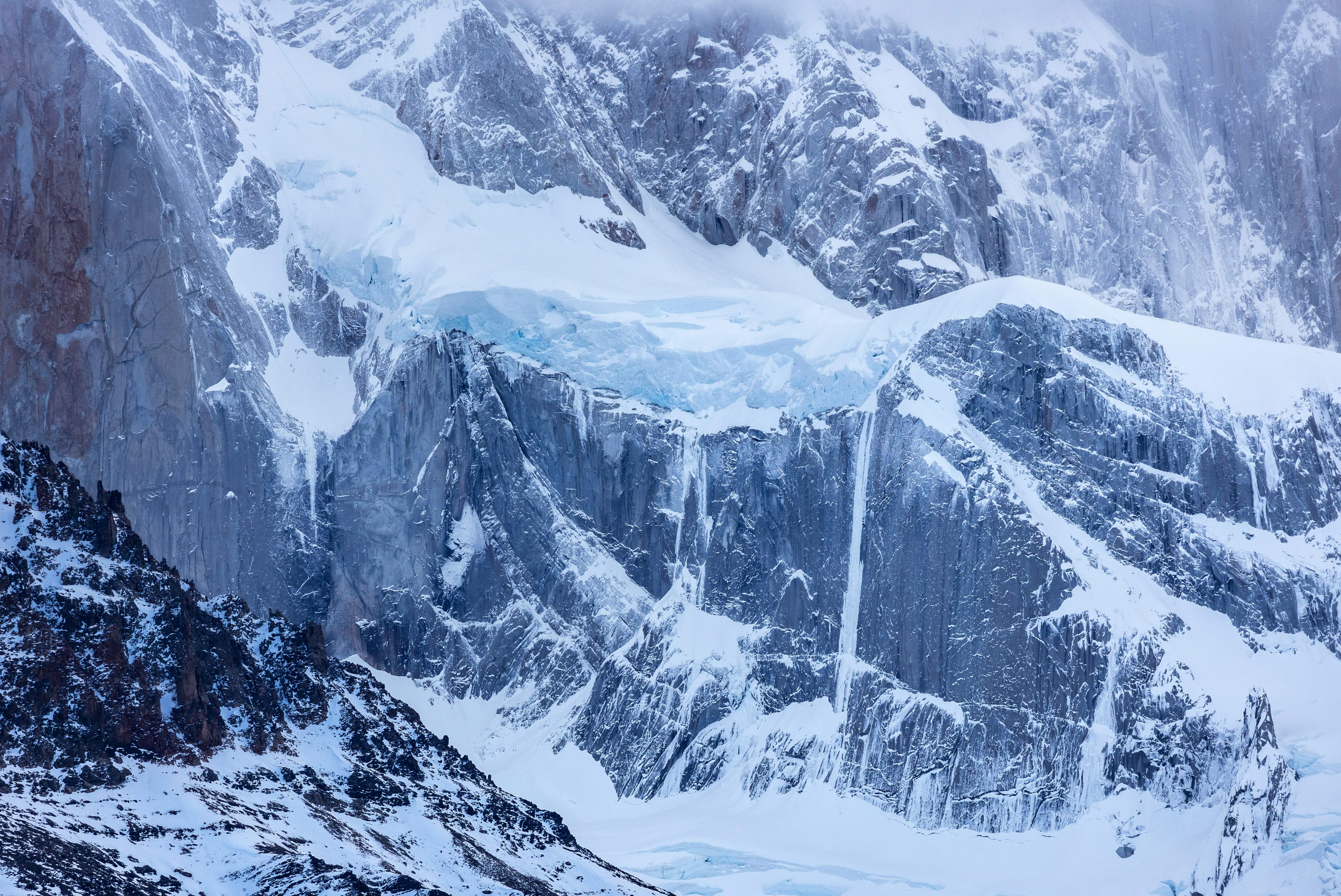 Ice and snow cascade down a majestic mountain. photo – Free Snow Image ...