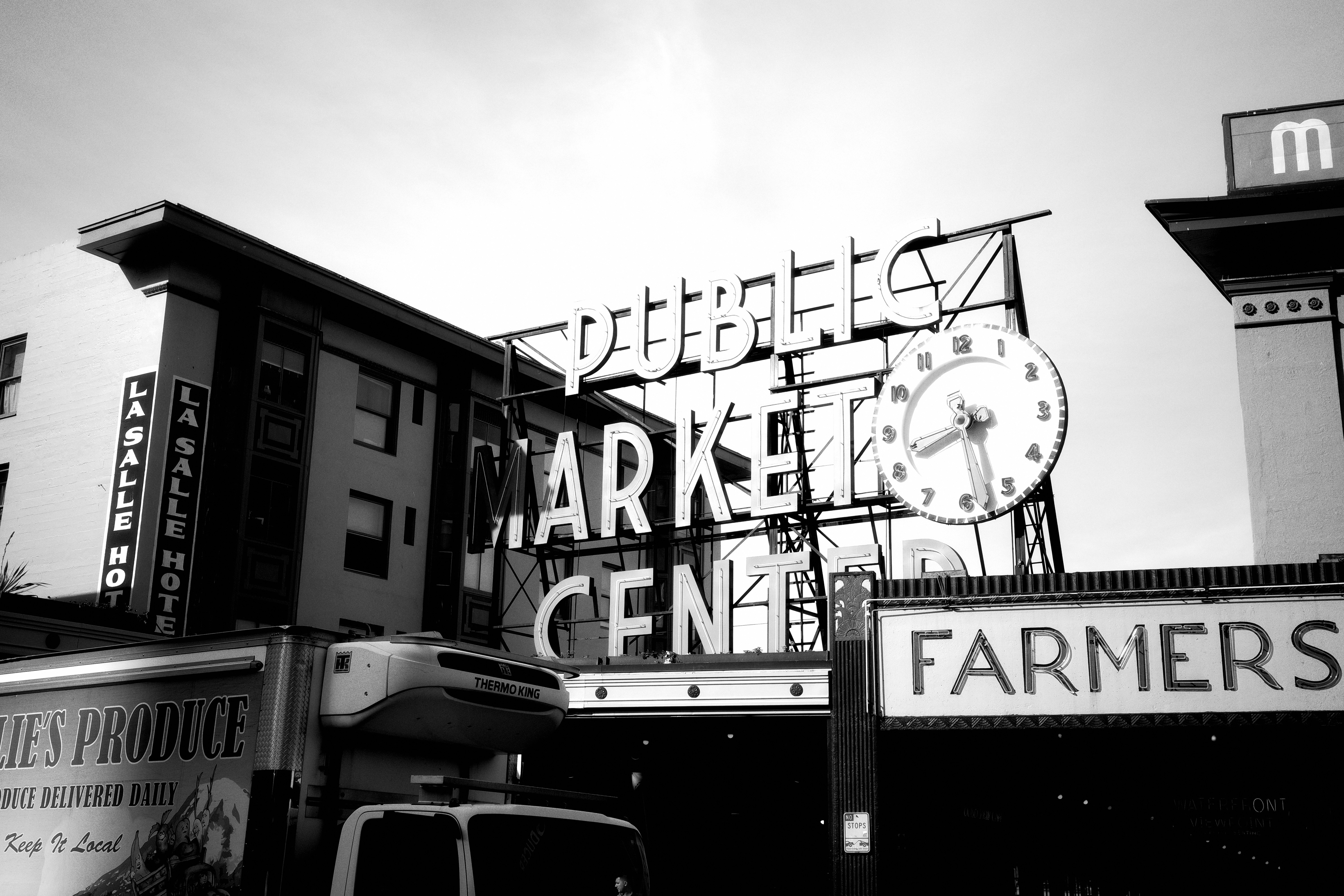 Timekeepers and Neon: A Monochrome Gateway to the Market Center