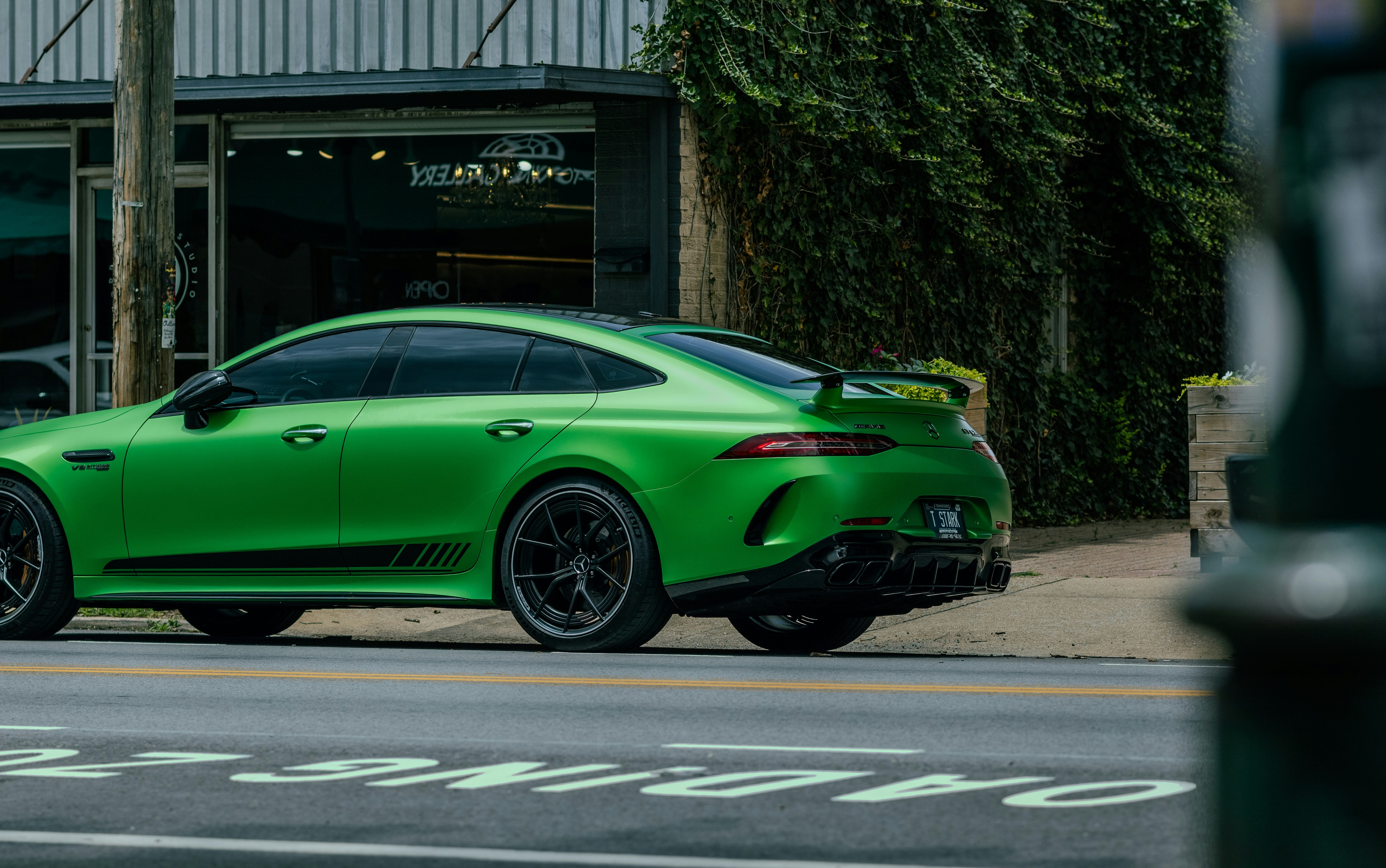 Lime Apex on the Street: neon-green sport sedan paused by the curb