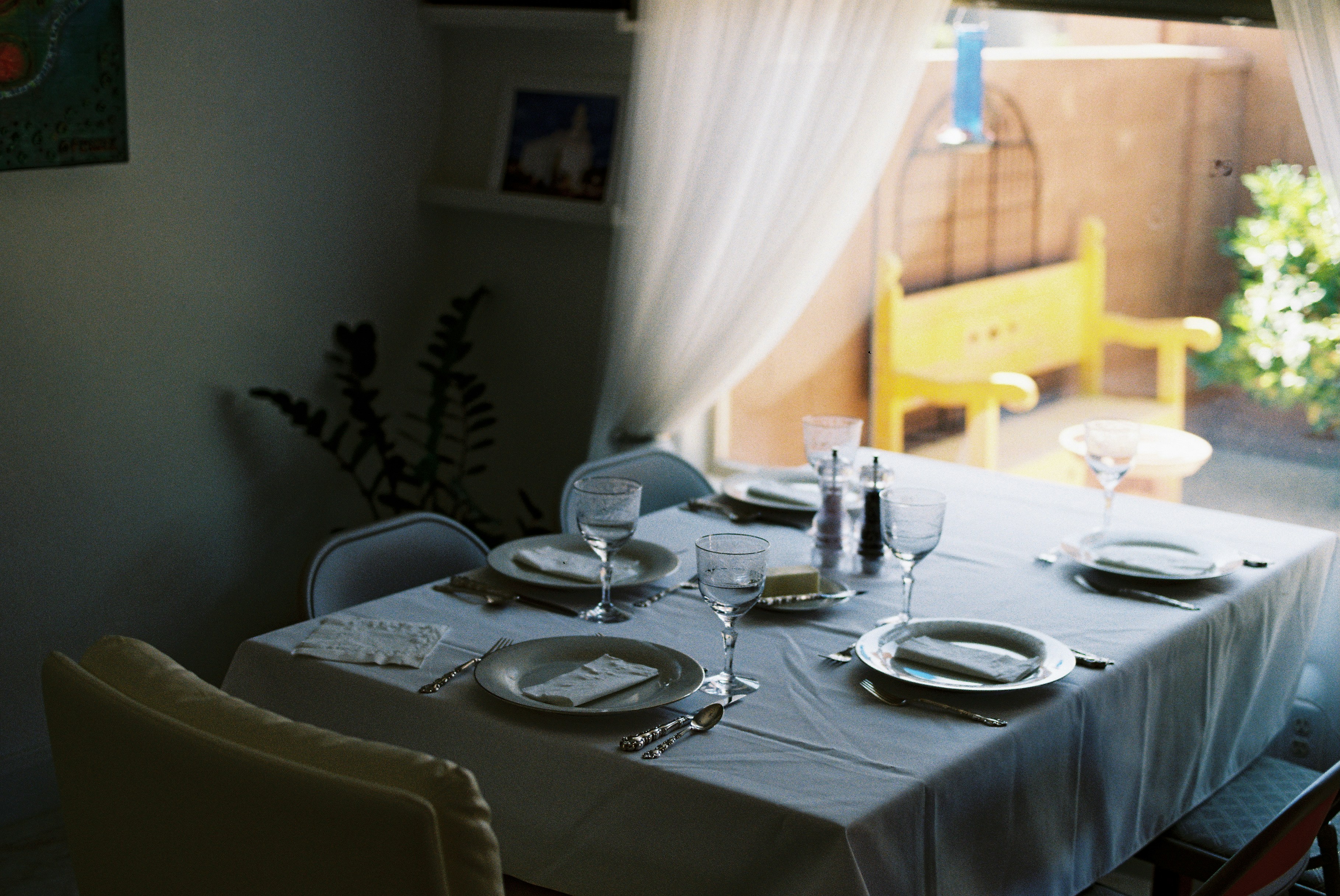 A table is set for a meal by a window. photo – Free Furniture Image on ...