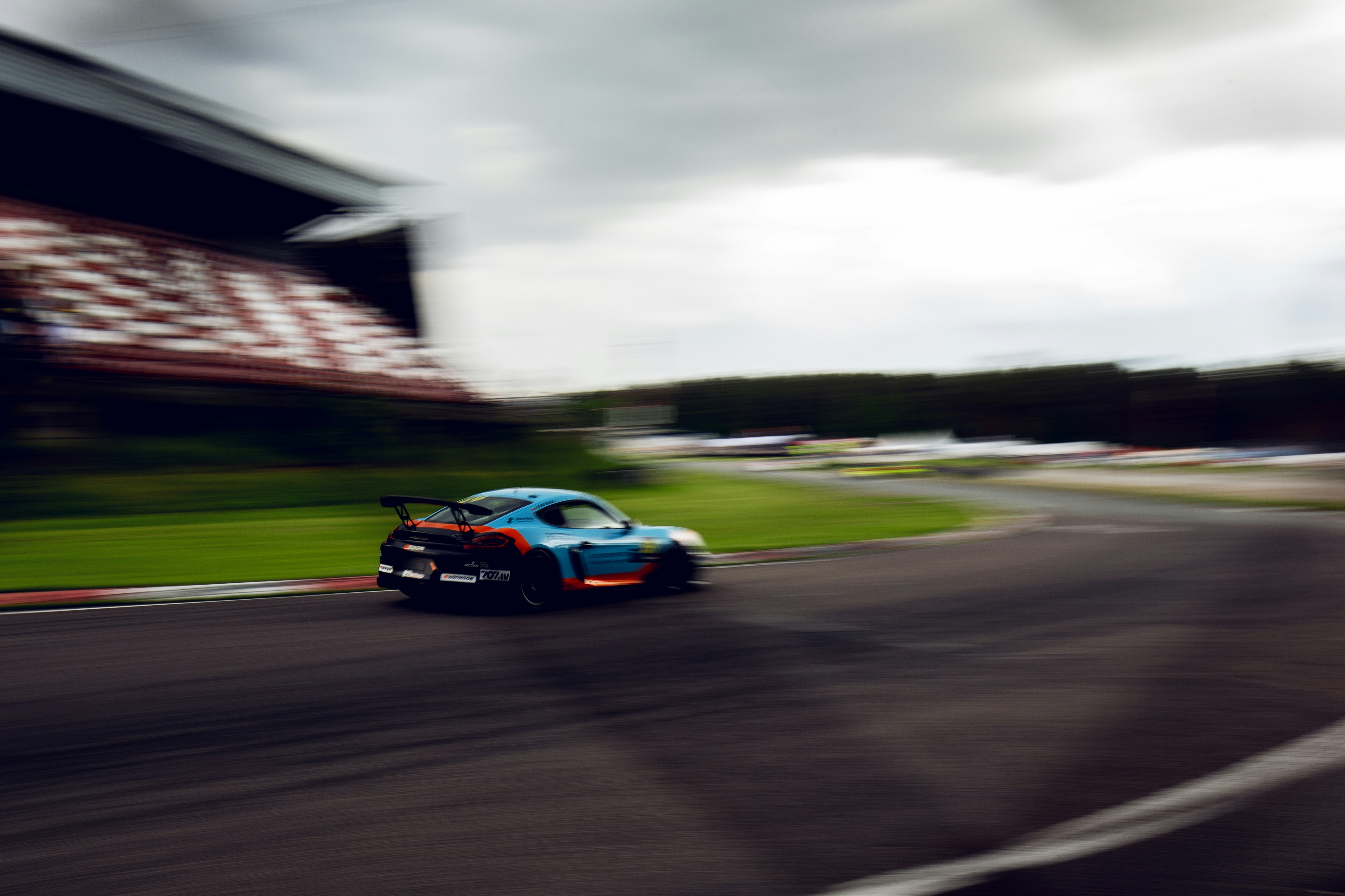 A sporty car drifting on a race track. photo – Free Car Image on Unsplash