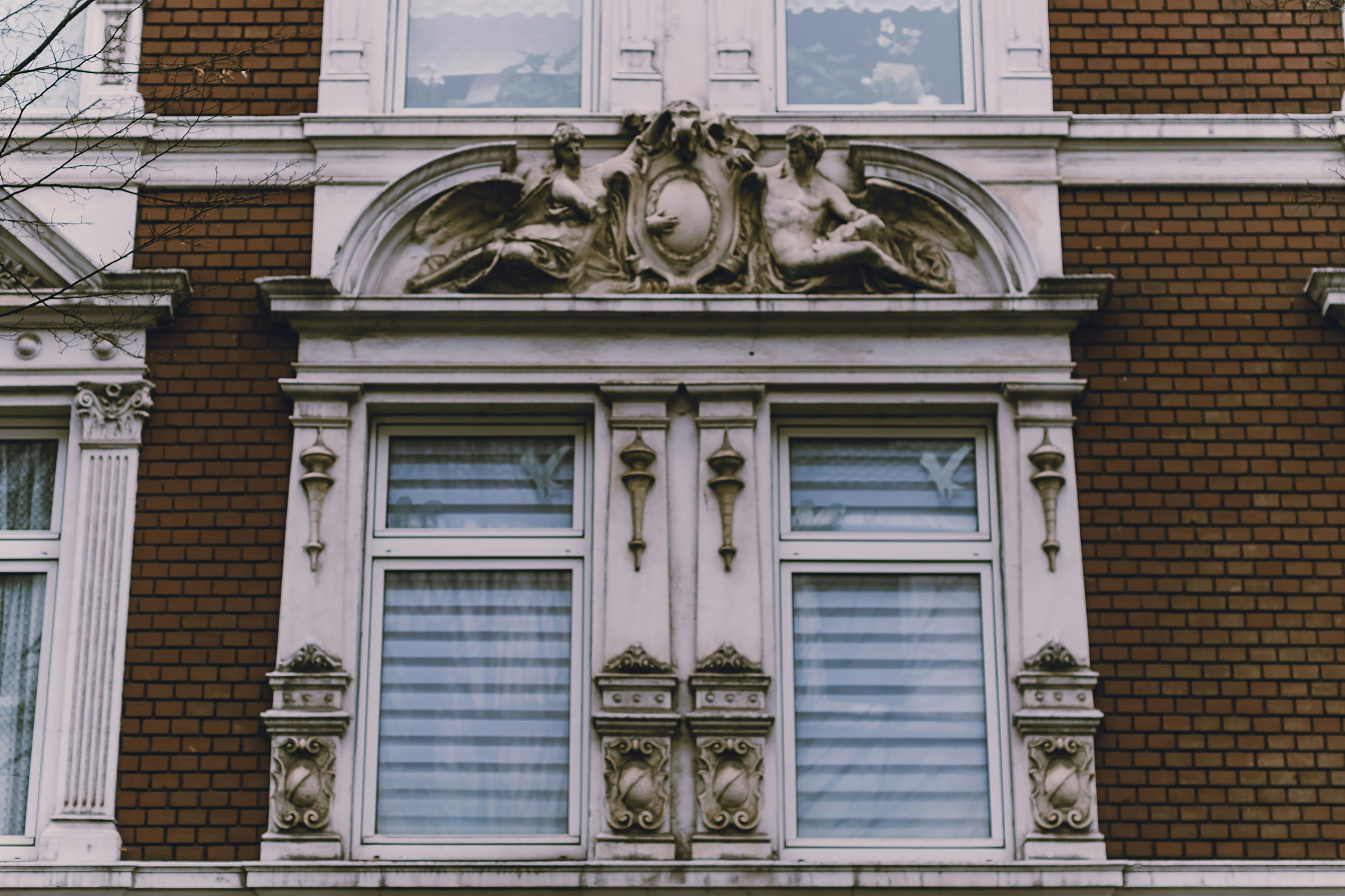 Detailed facade with ornate carvings and windows. photo – Free Building ...