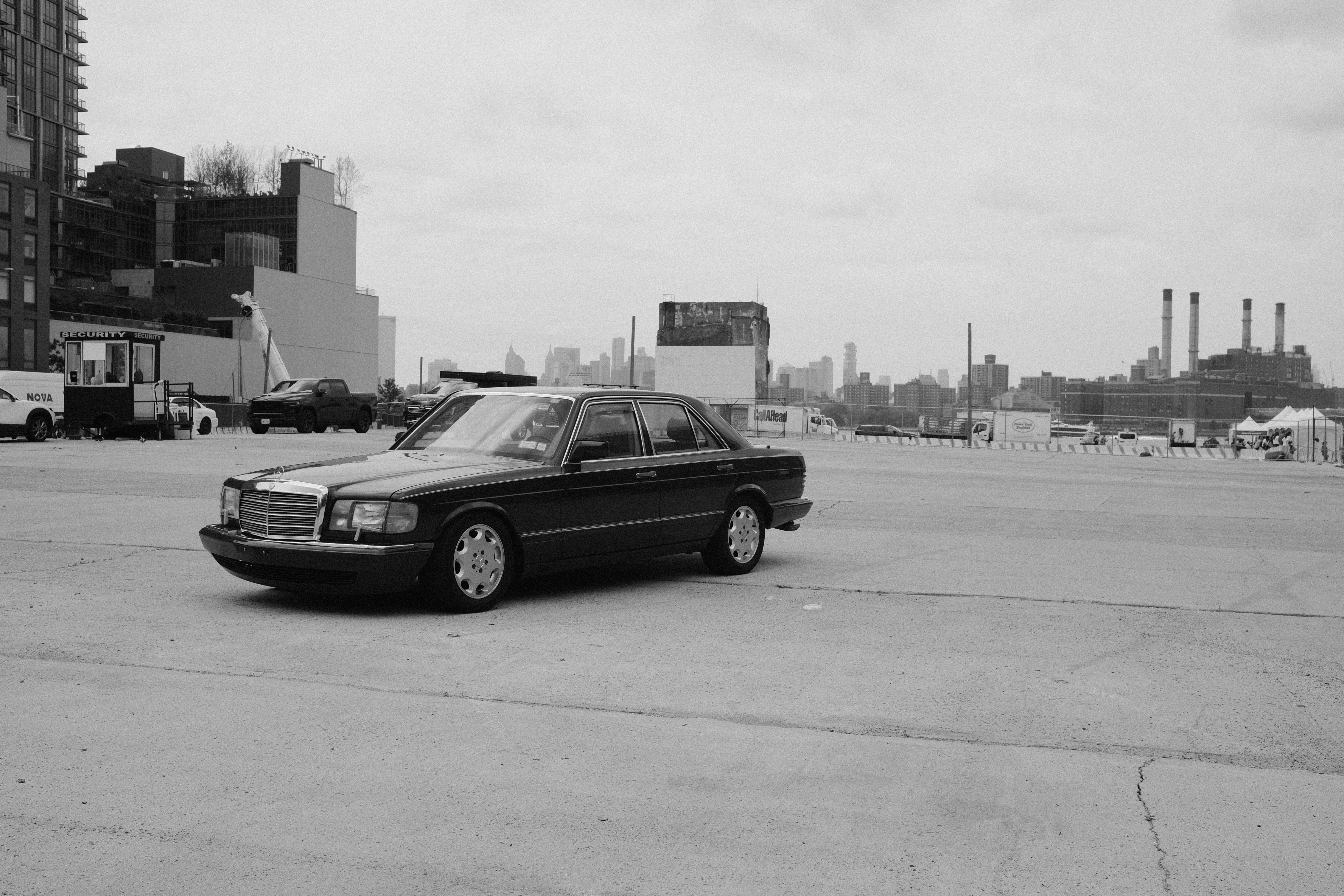 A vintage mercedes-benz sits in a parking lot. photo – Free Car Image ...