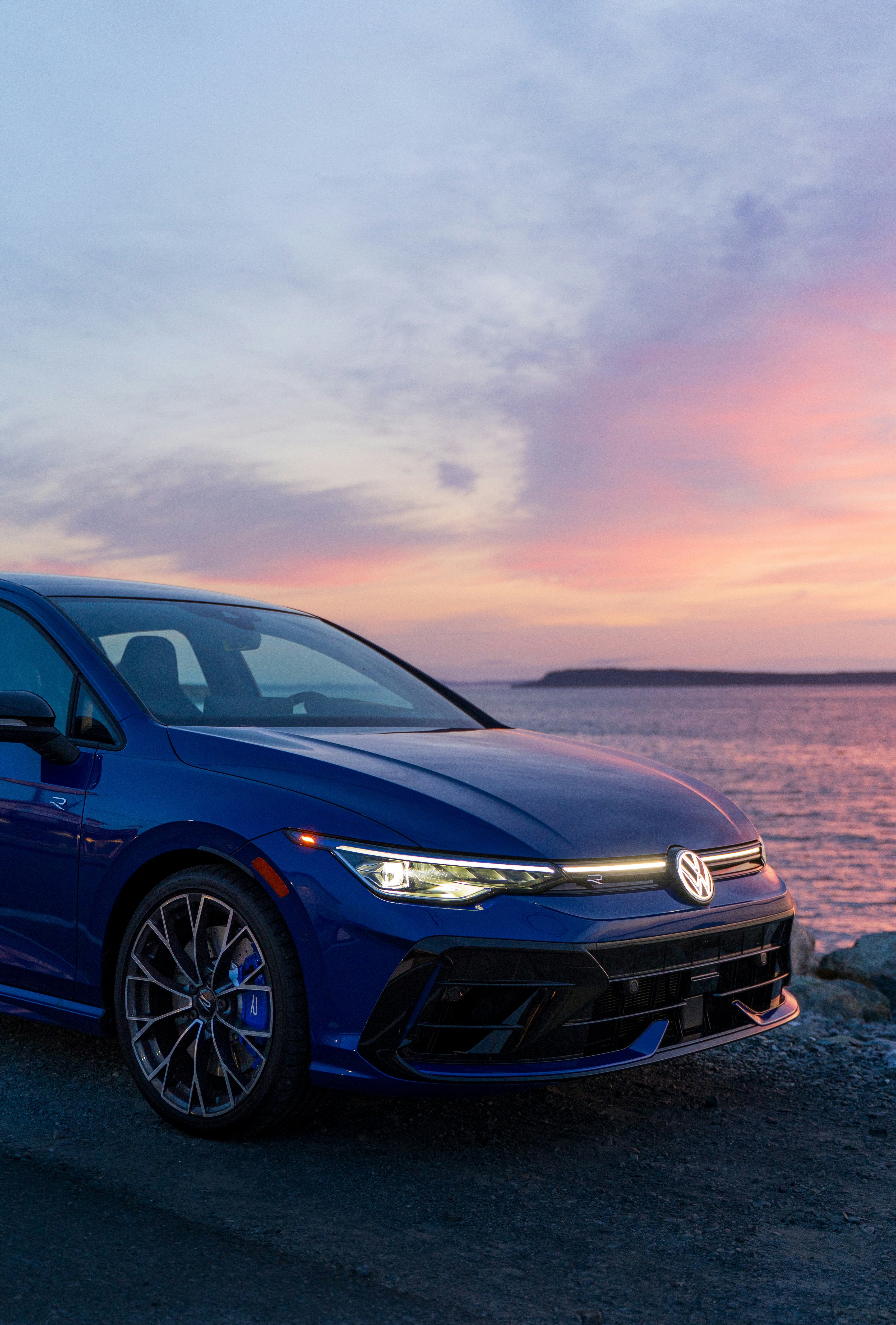 A blue volkswagen golf r parked at sunset. photo – Free Golf Image on ...