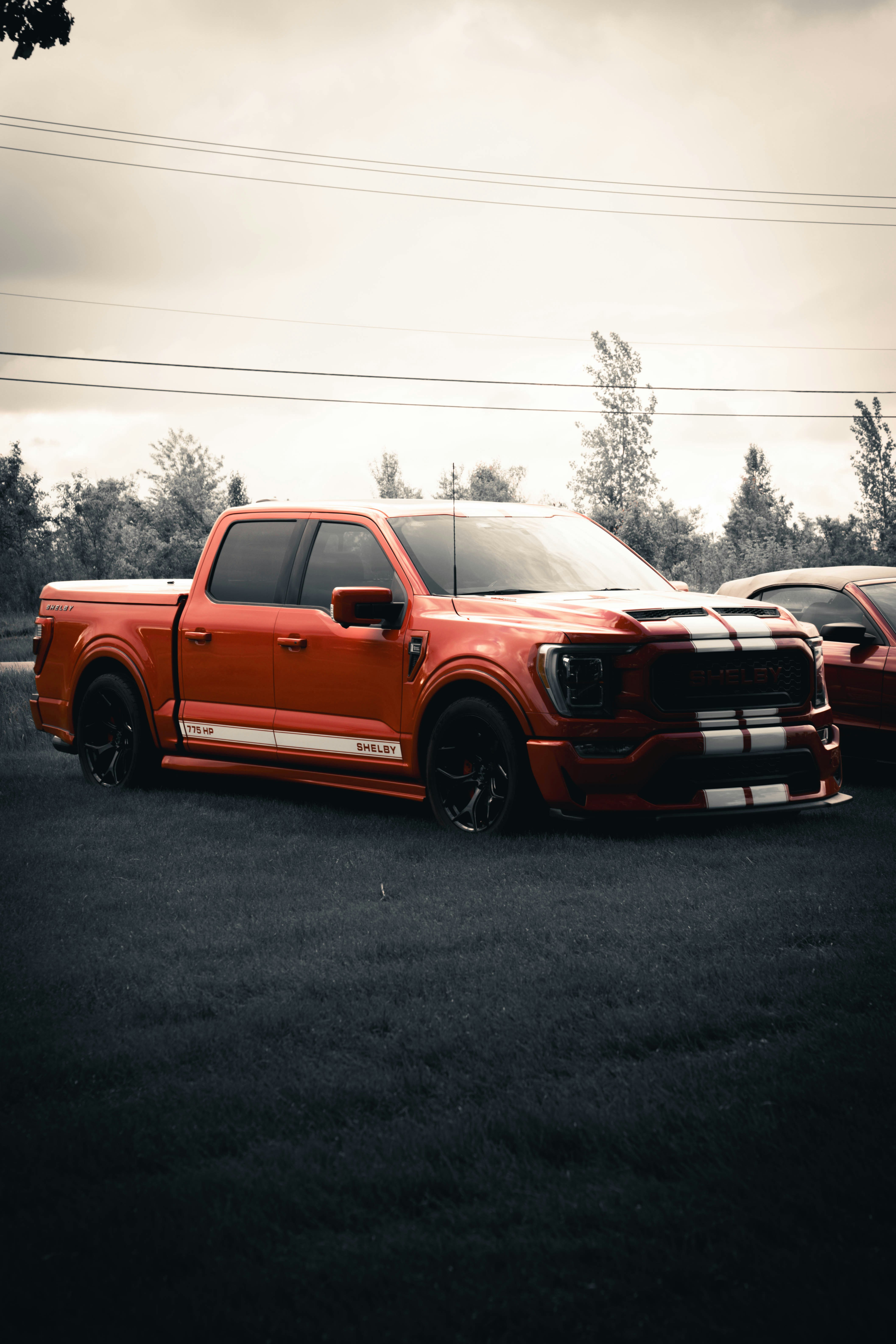 A custom, orange shelby ford truck is parked. photo – Free Car Image on ...