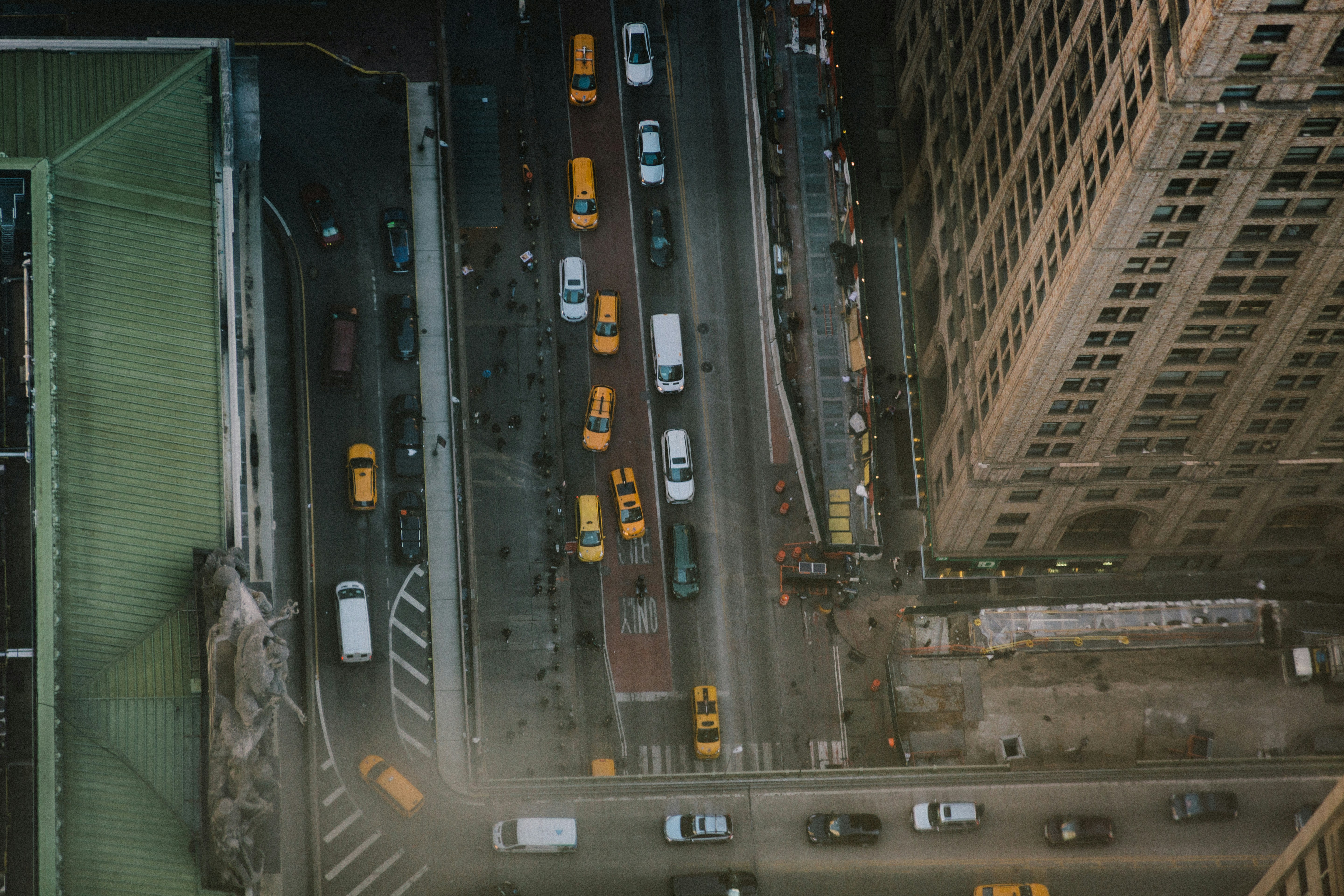 A bird's-eye view of busy city traffic. photo – Free Building Image on ...