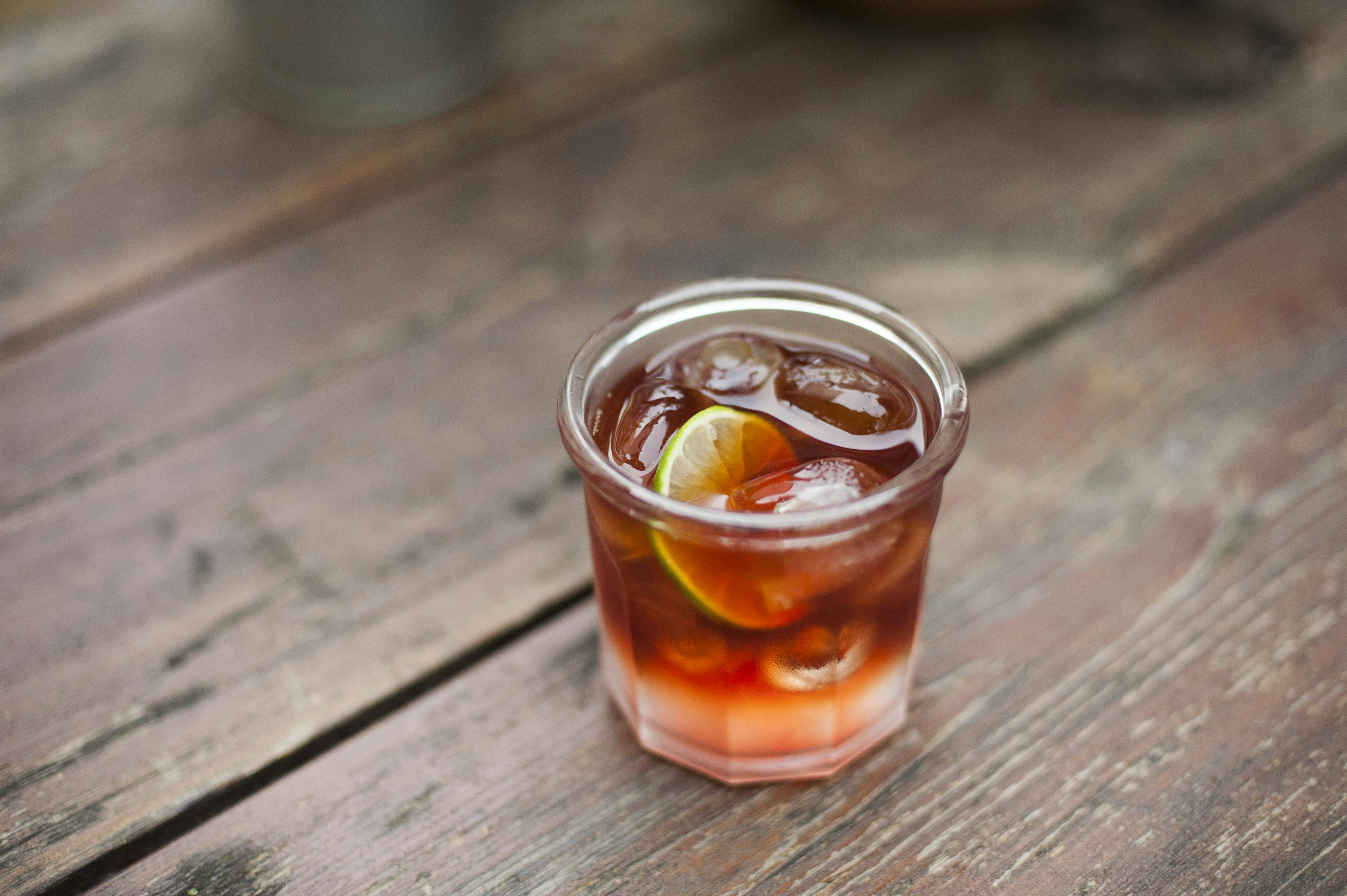 A refreshing drink with ice and lime.