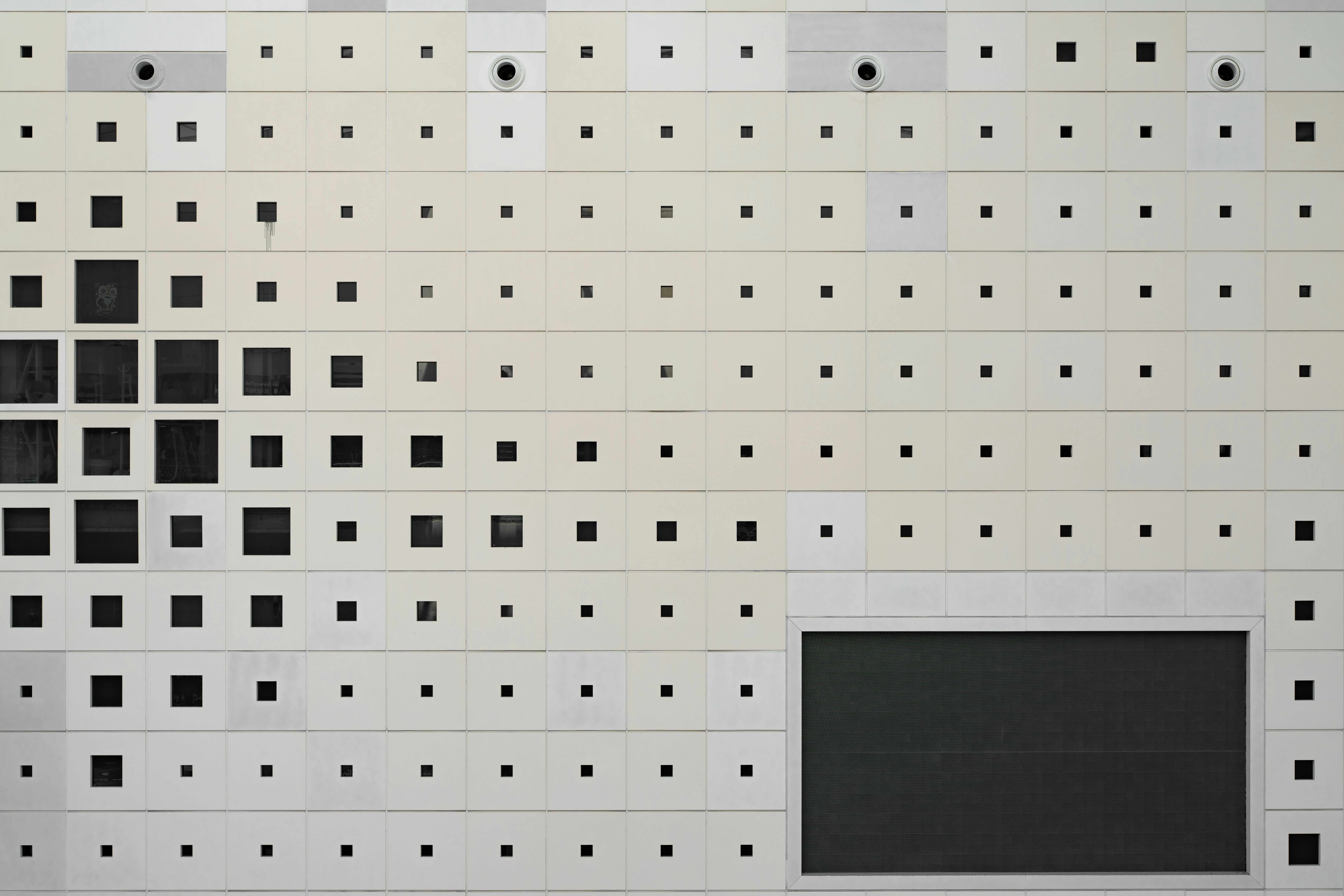 Checkerboard Facade: A Quiet Window in the Grid